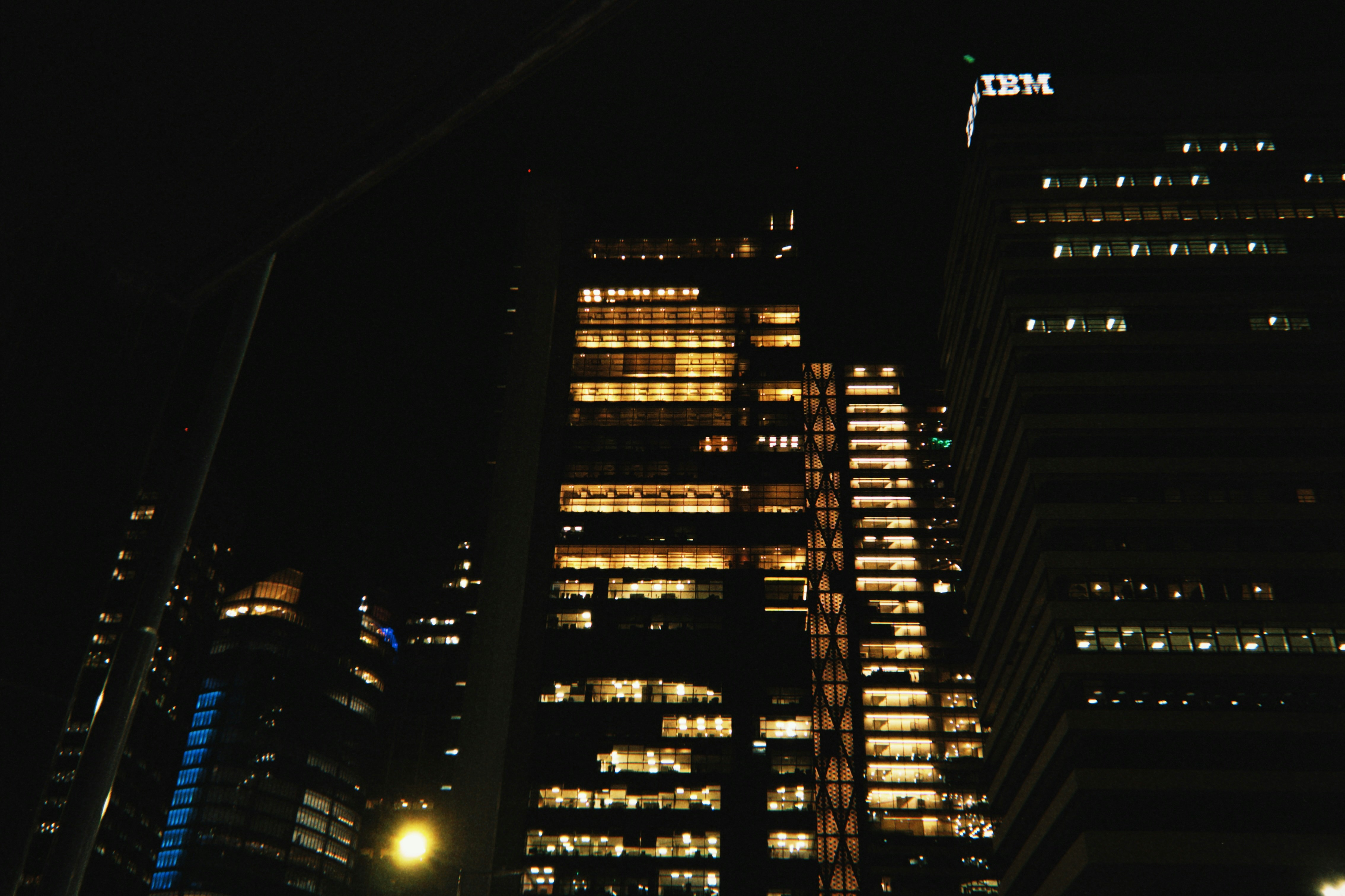 Nighttime Skyscrapers: Glowing Windows in the Corporate Canyon