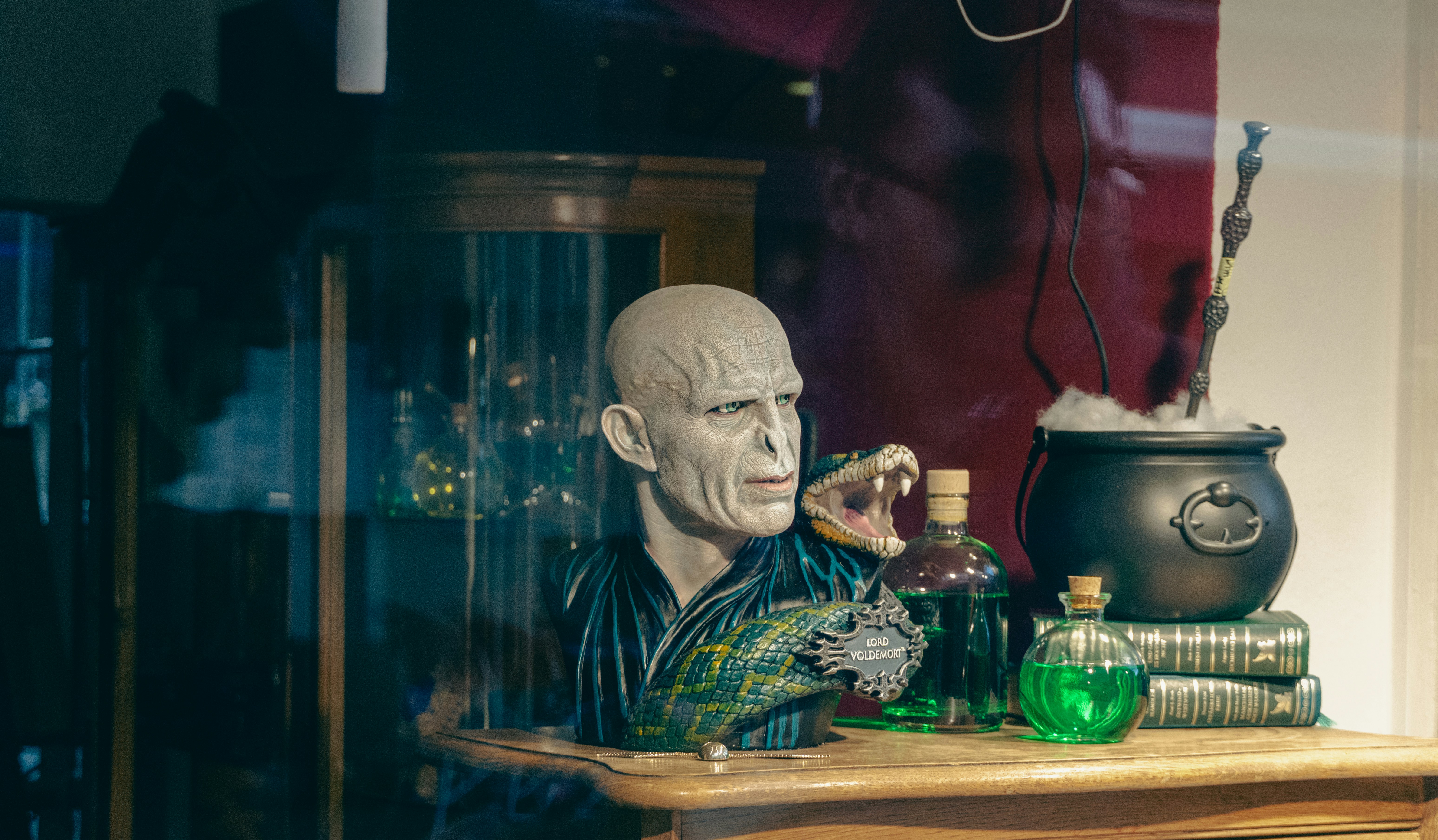 Glass Bottles and a Grey Statue: A Quiet Apothecary Still Life