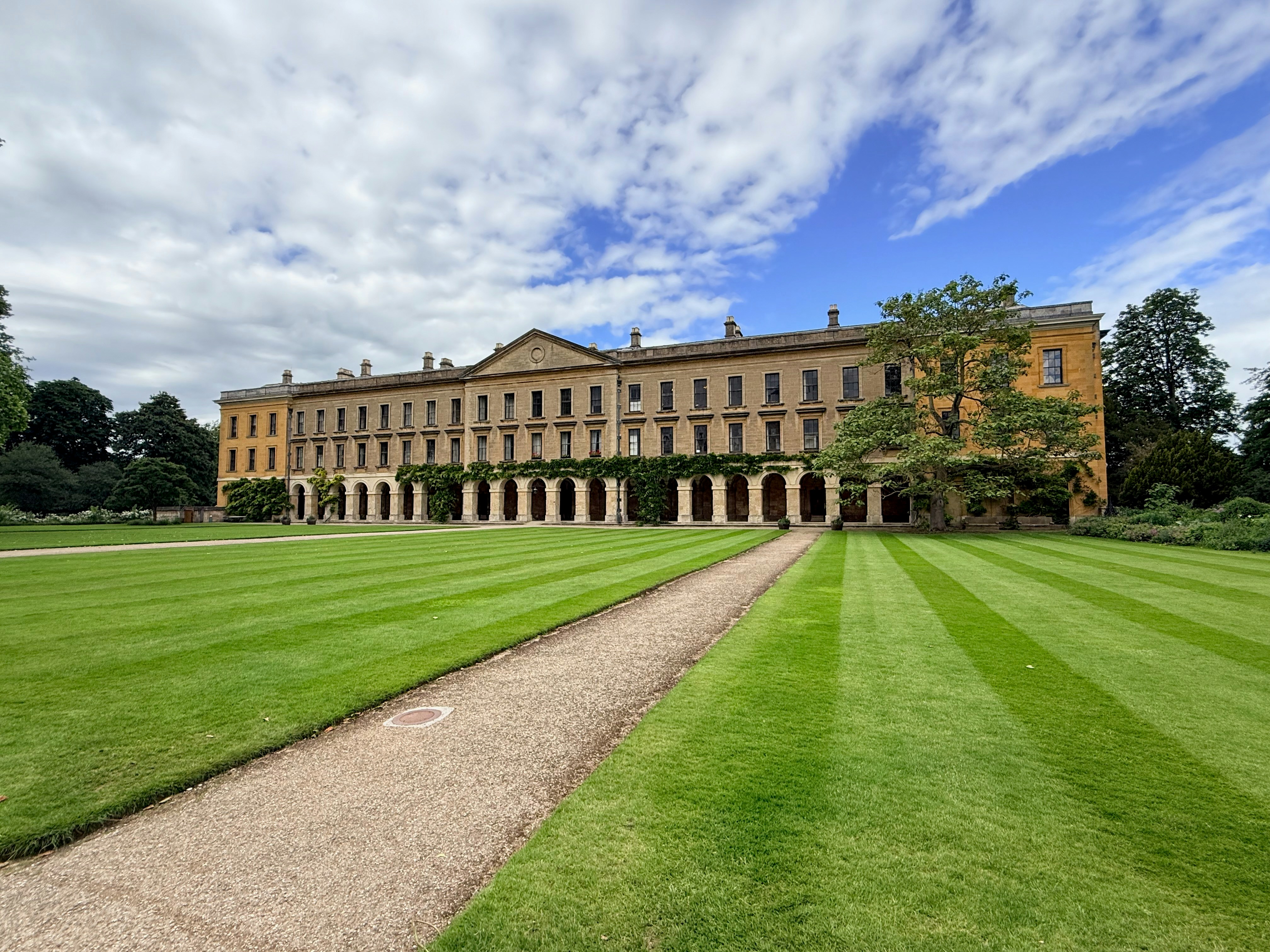 Heritage Manor: A Symmetrical Facade Framed by Verdant Stripes