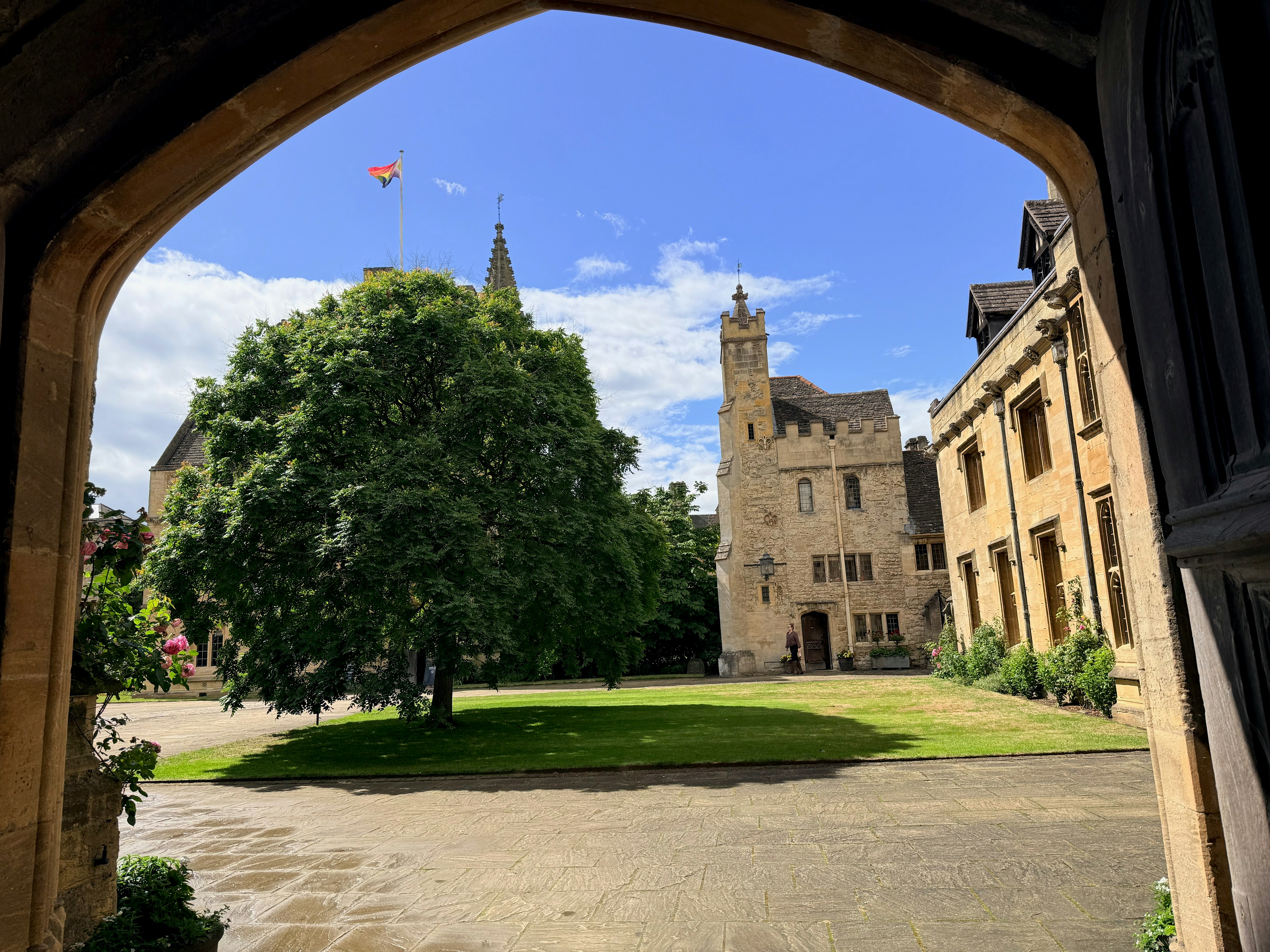 Courtyard Arc: A Sunlit Keep Framed by Archway