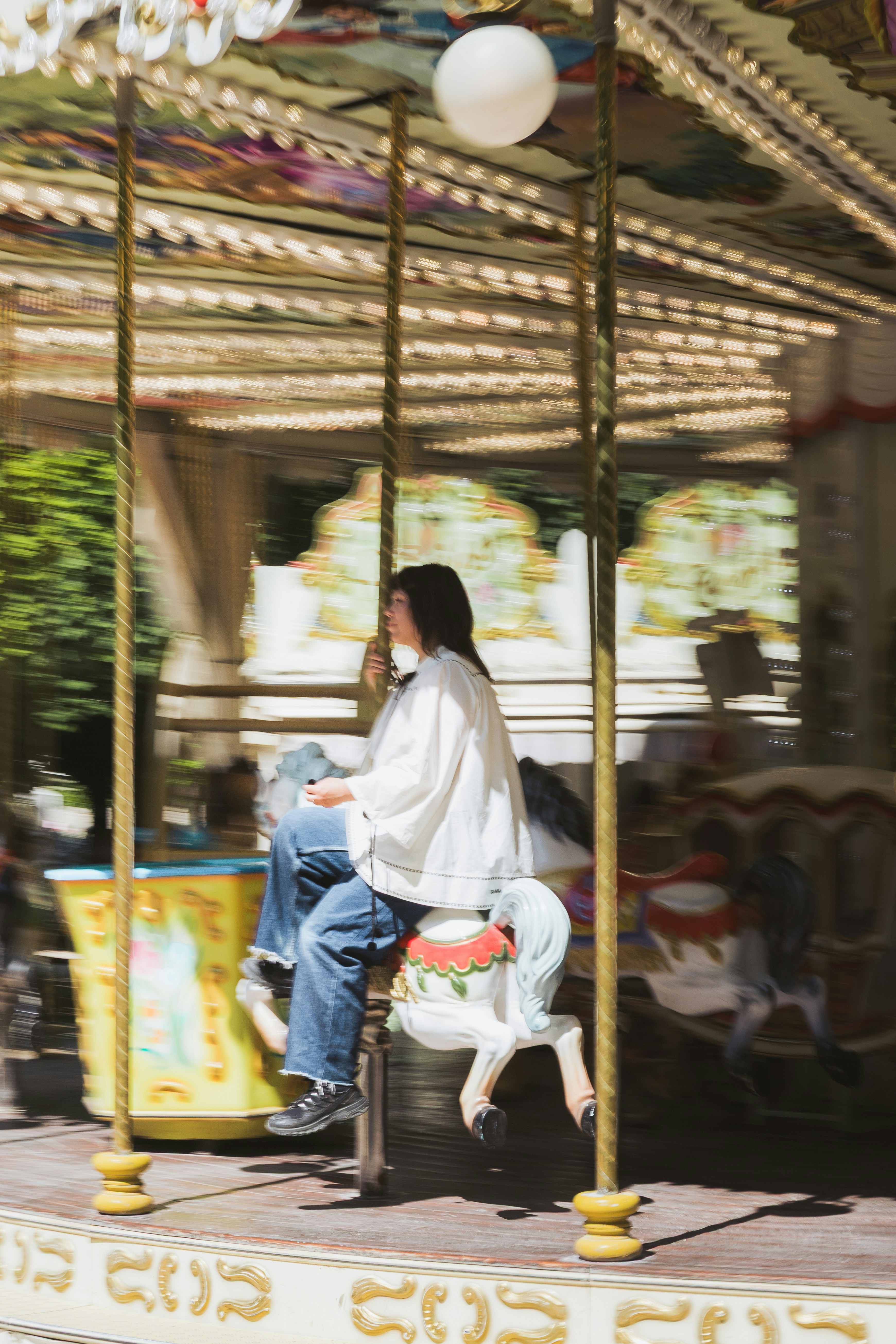 Whirl of Color: A Moment on the Carousel