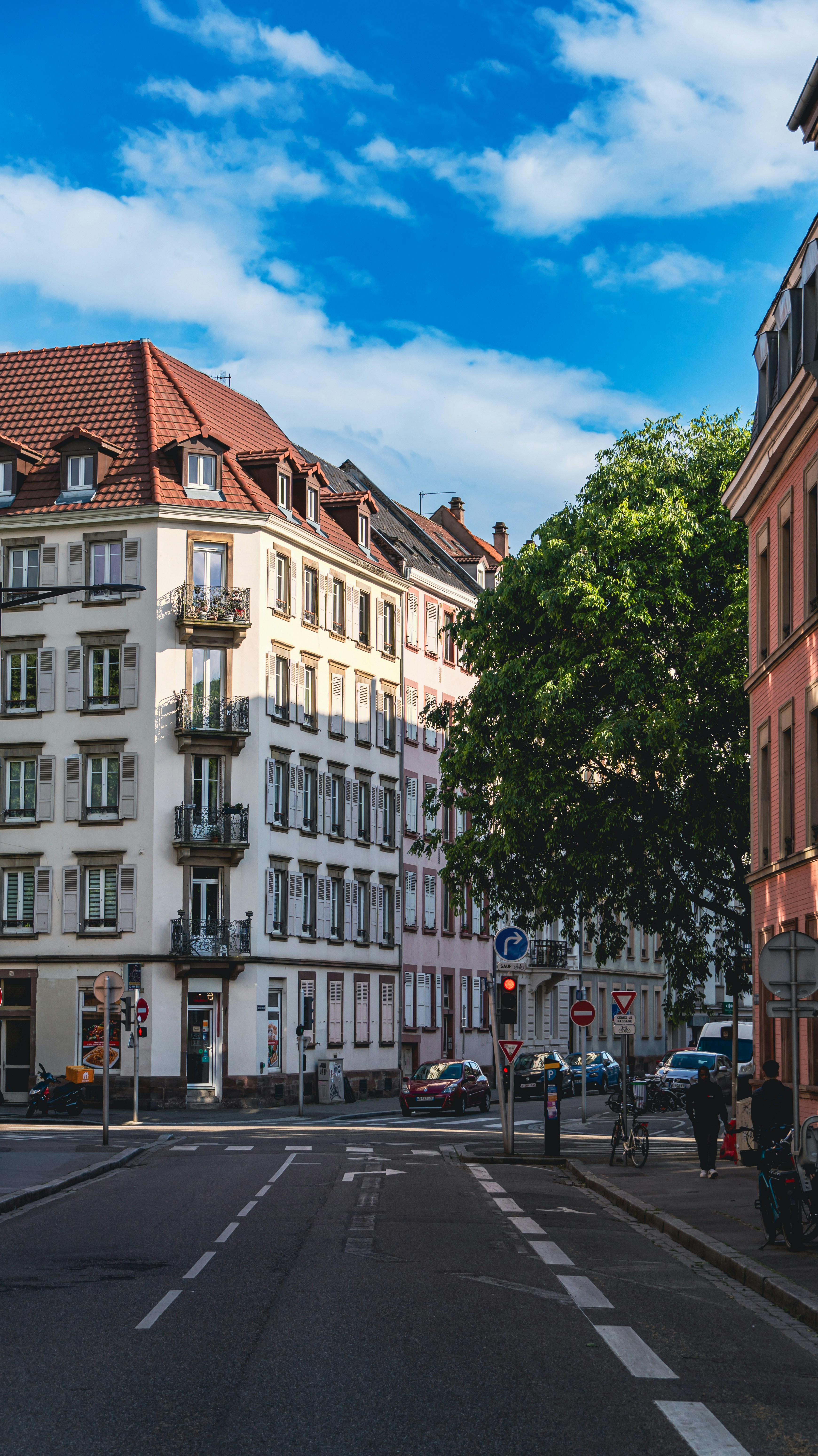 Urban Cascade: Sunlit Facades and Shaded Street in a European Quarter
