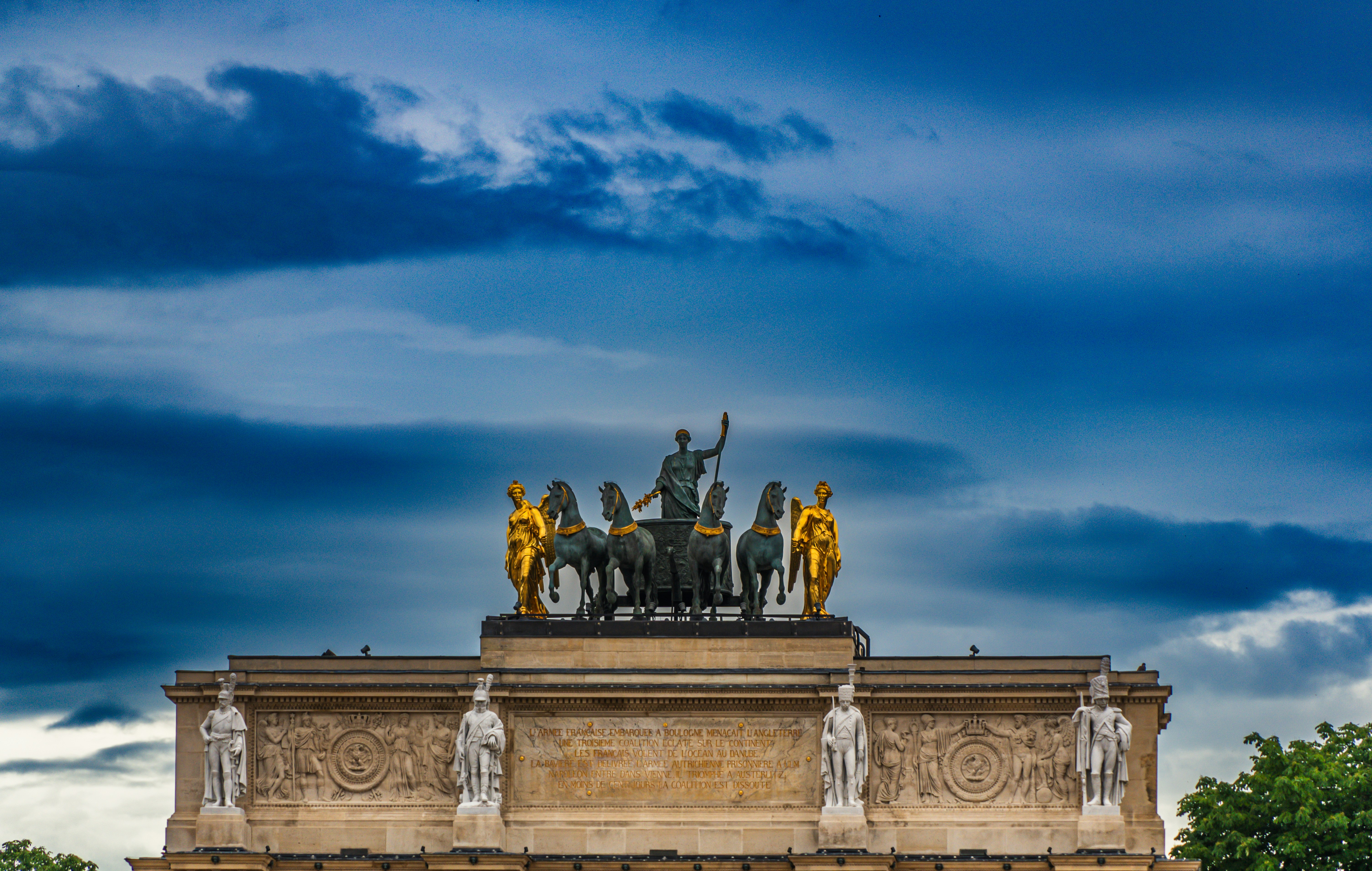 Golden Riders at Dusk: A Monumental Silhouette Against a Turquoise Sky