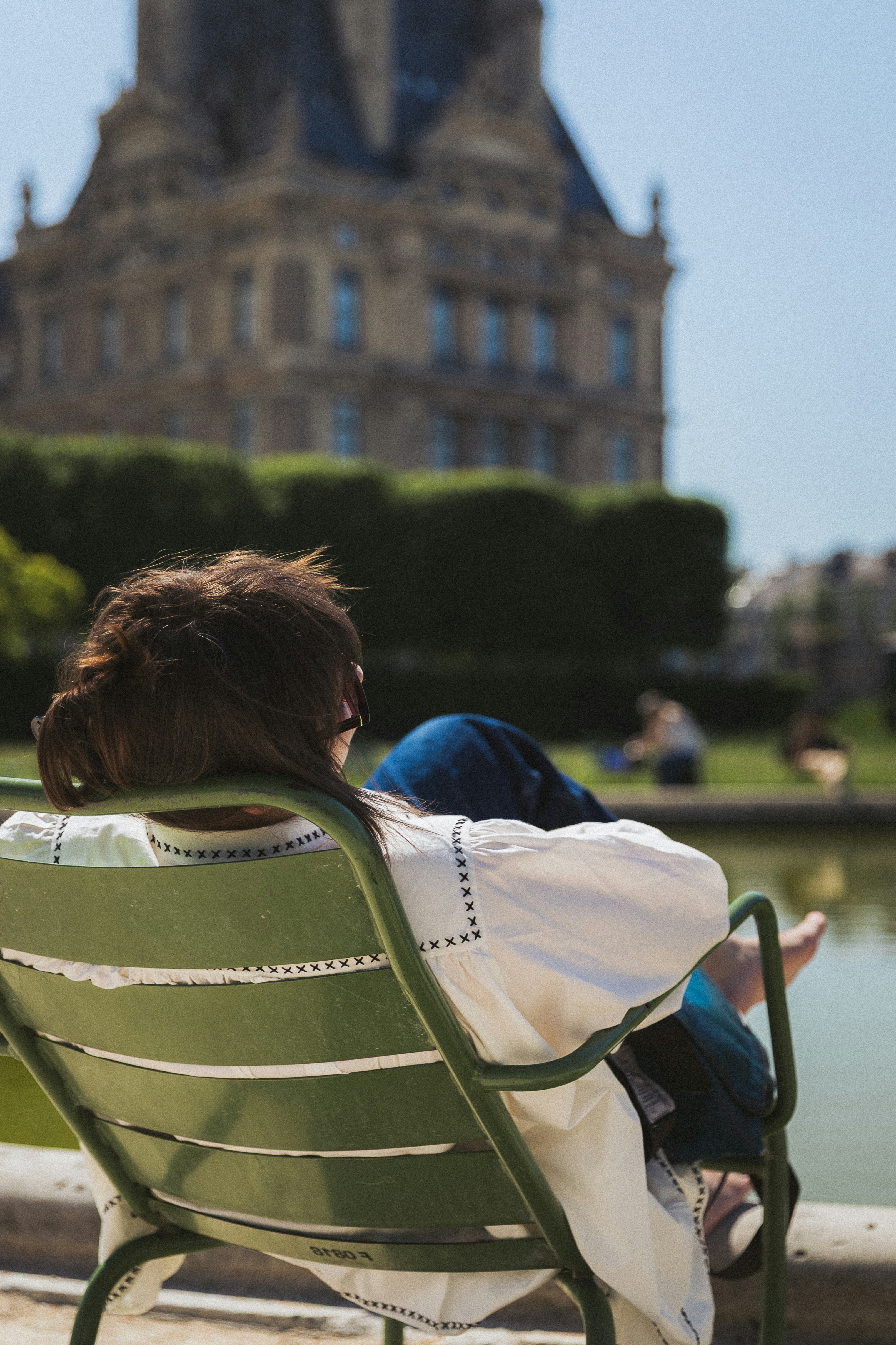 Shaded Recline: A Quiet Moment Before the City’s Echo