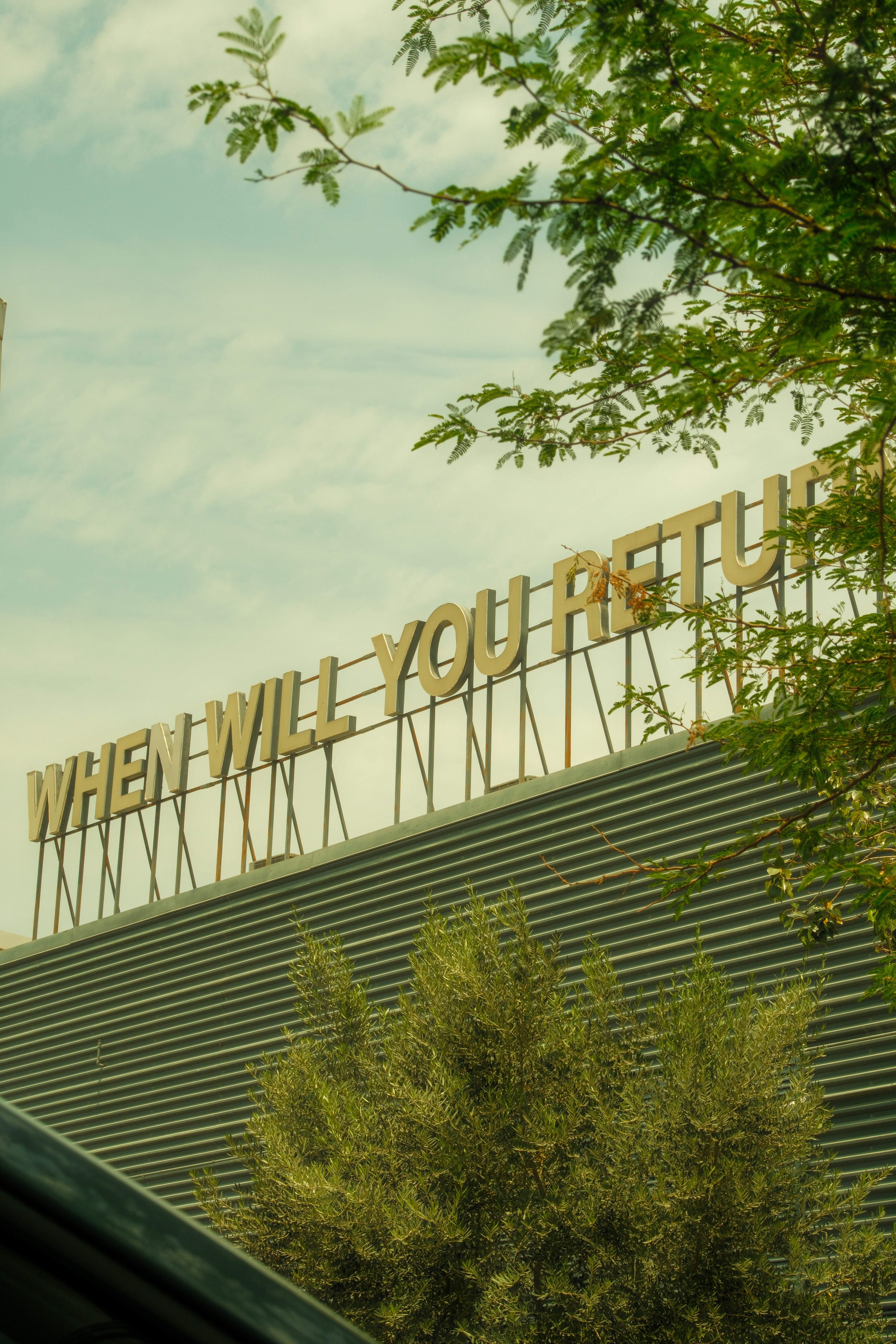 Sign Above the Street: When Will You Return