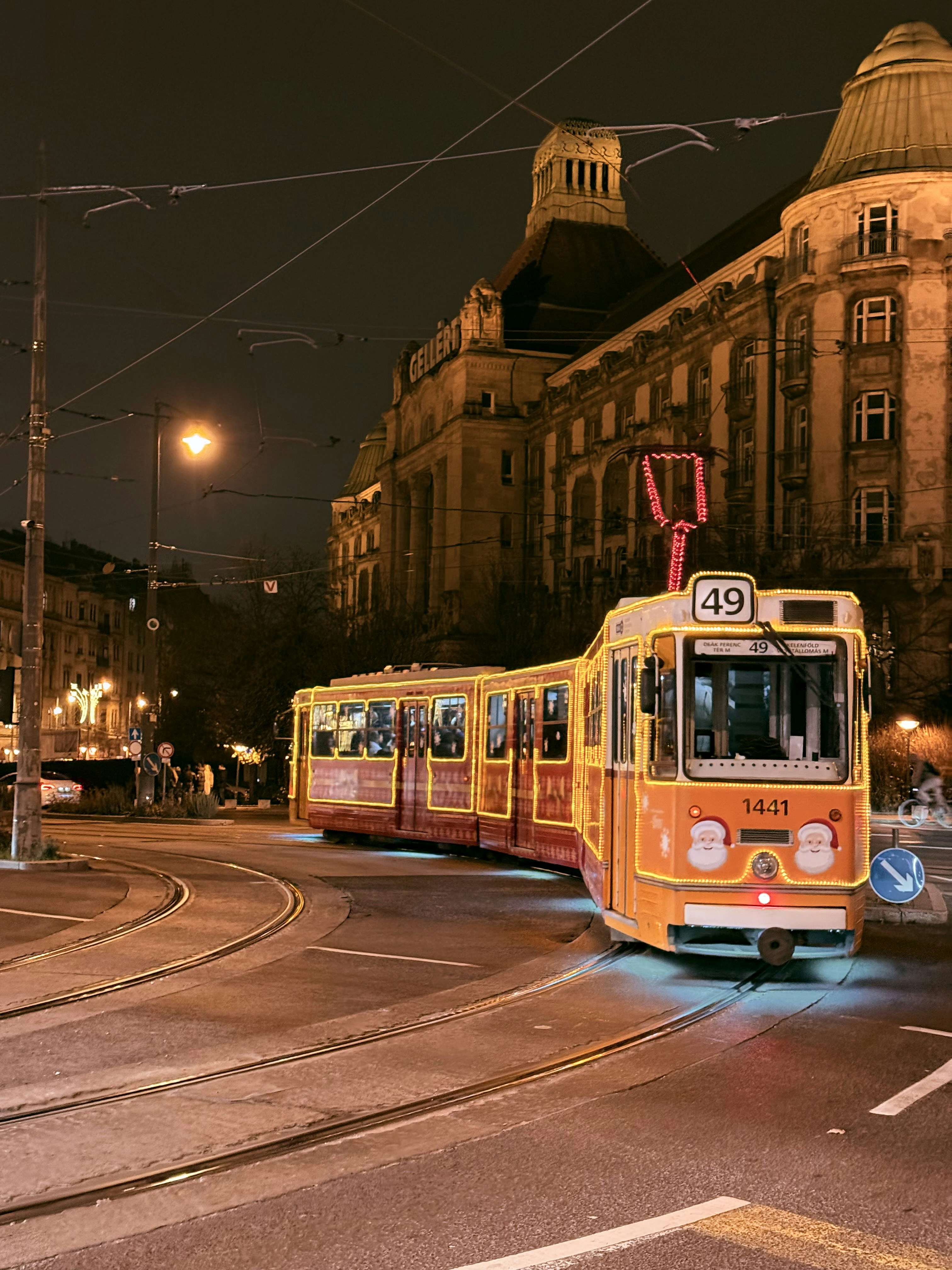 Night Tram Gliding Through Neon-Illuminated Streets