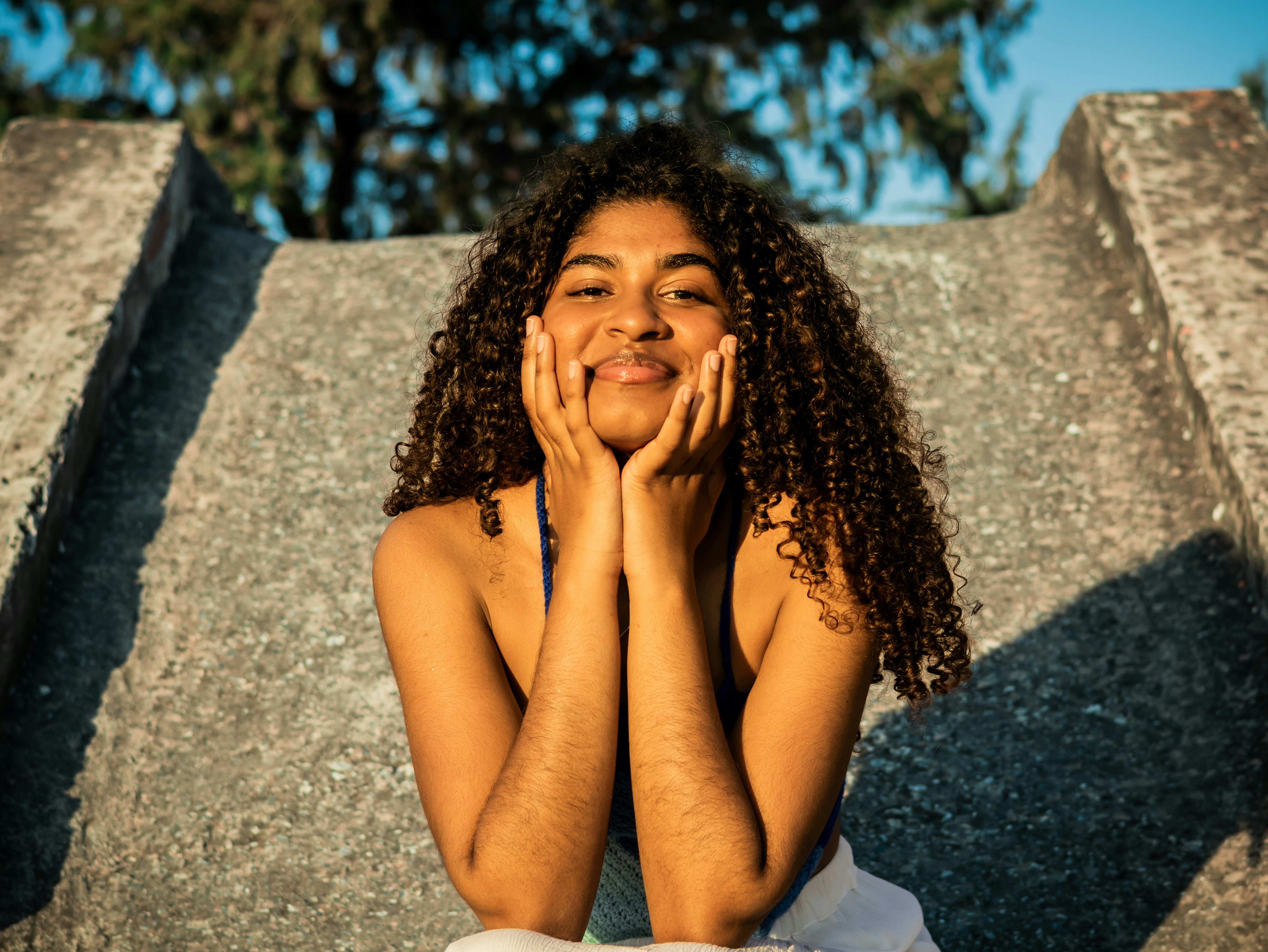 Sunlit Confidence: Portrait on Concrete Steps