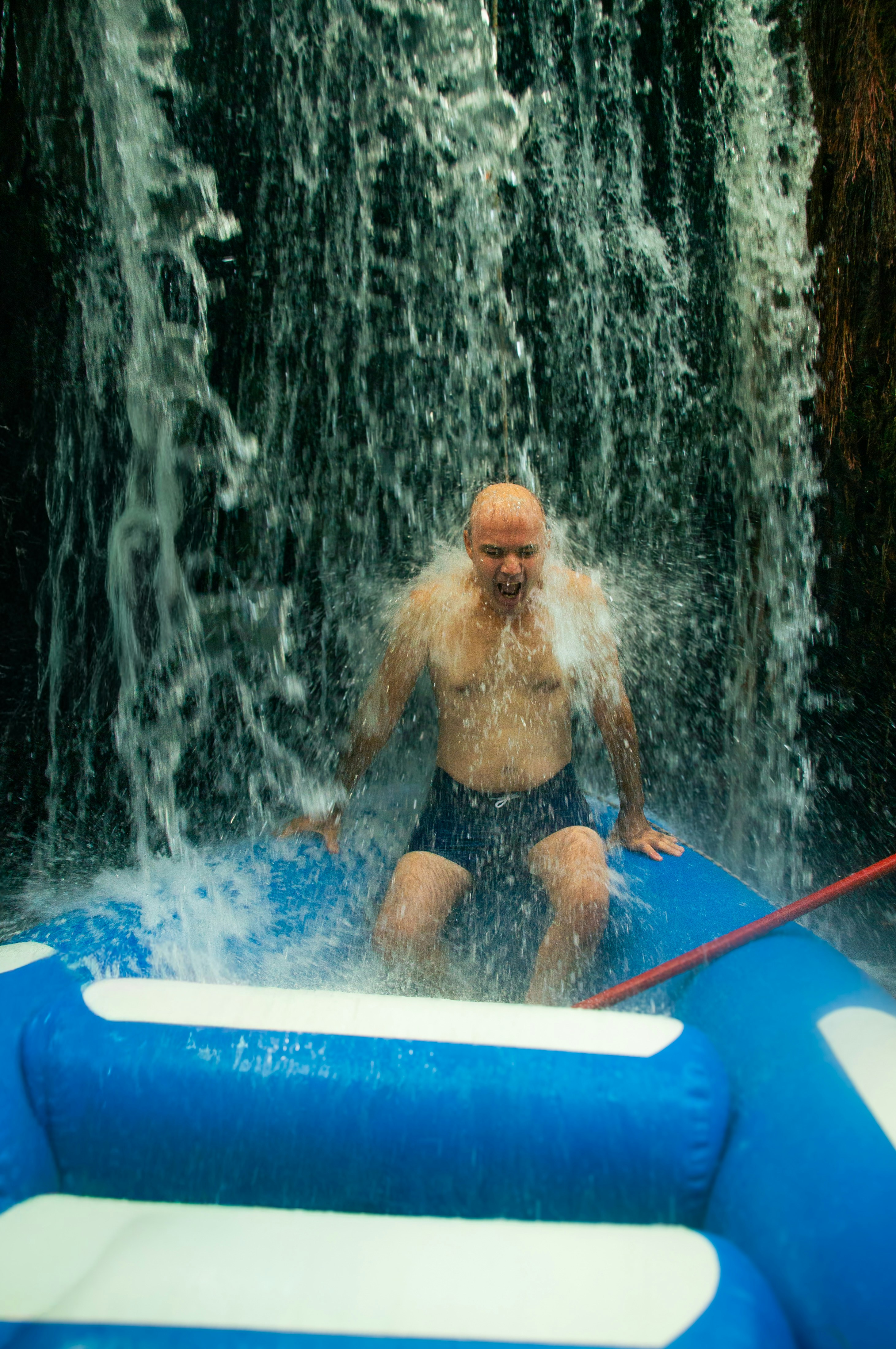 Rushing Water Front: Man Surfs a Waterfall-Stream Ride