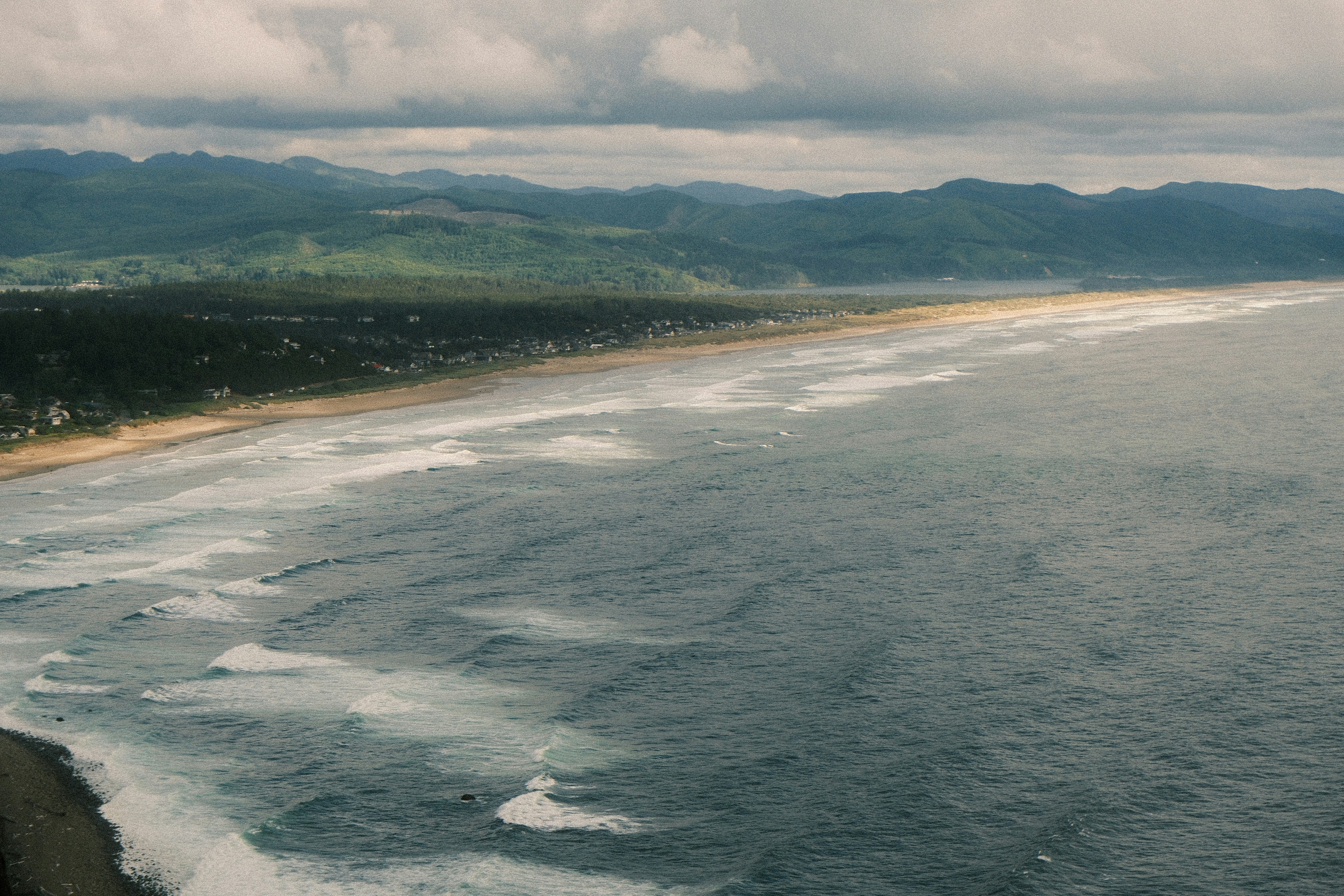 Coastal Ridge: Aerial Span Where Sea Meets Shore