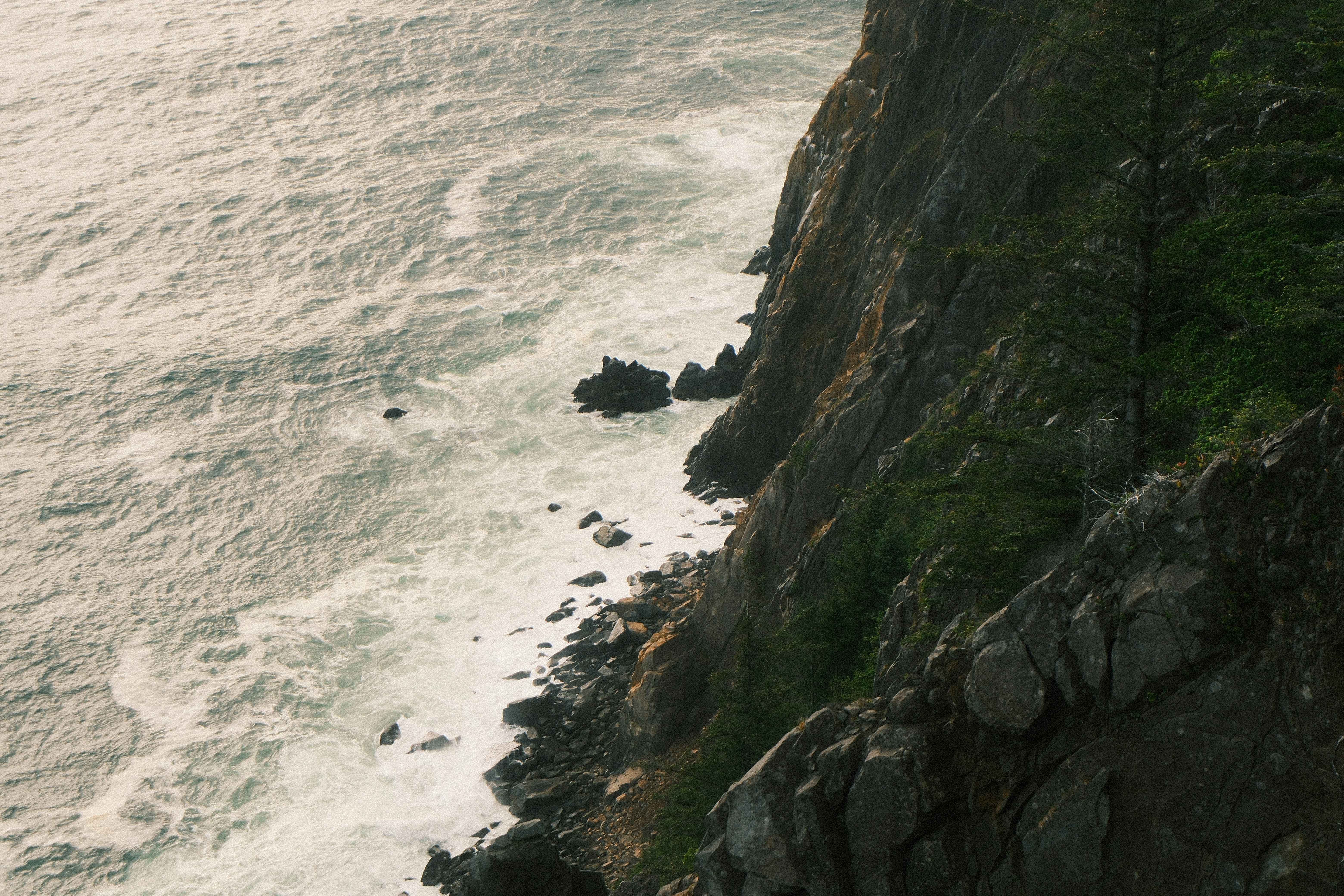 Cliffbound Shoreline: Waves Meet Weathered Rock
