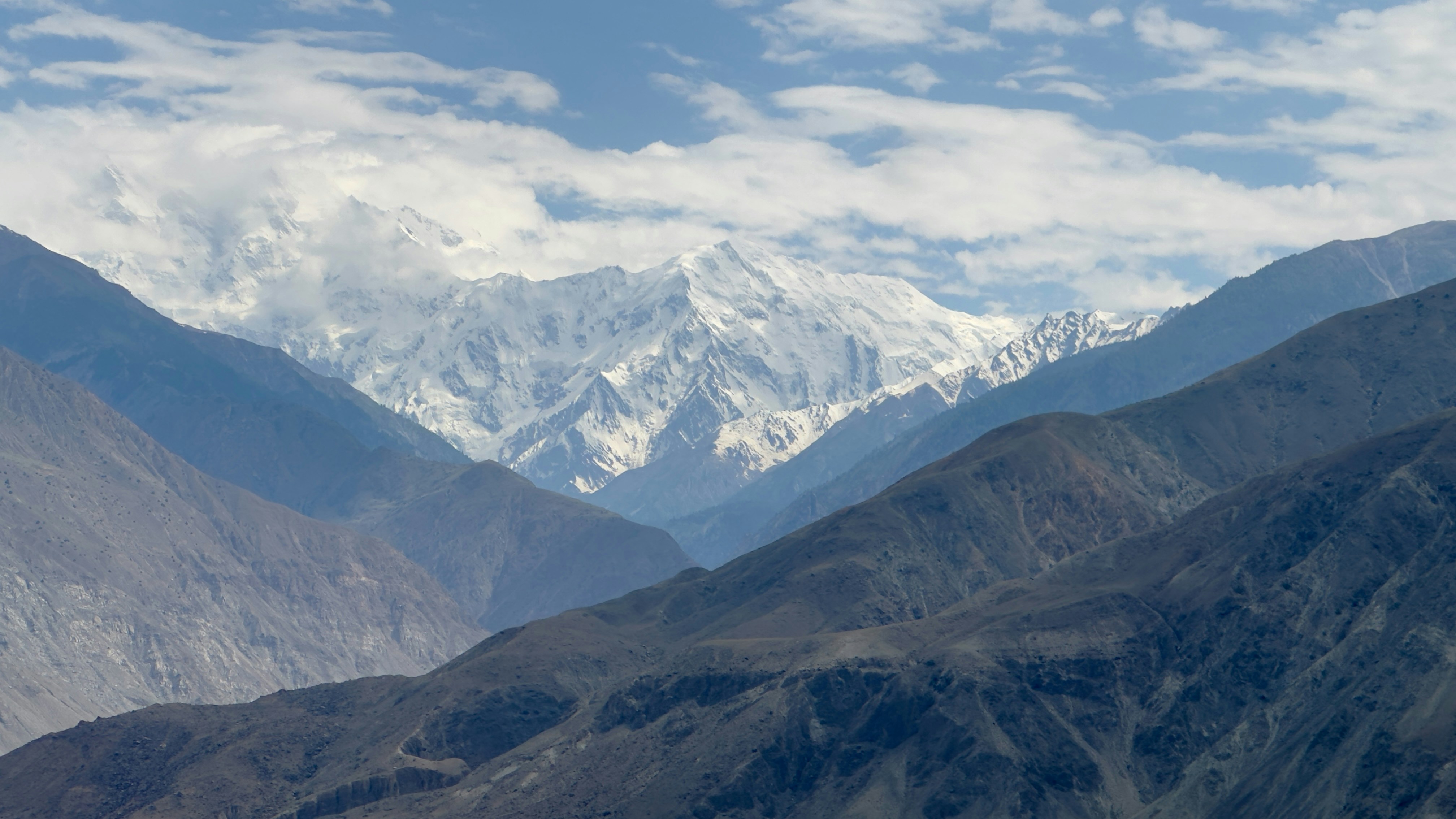 Echoes of the High Pass: Snow-Chiseled Peaks Beyond
