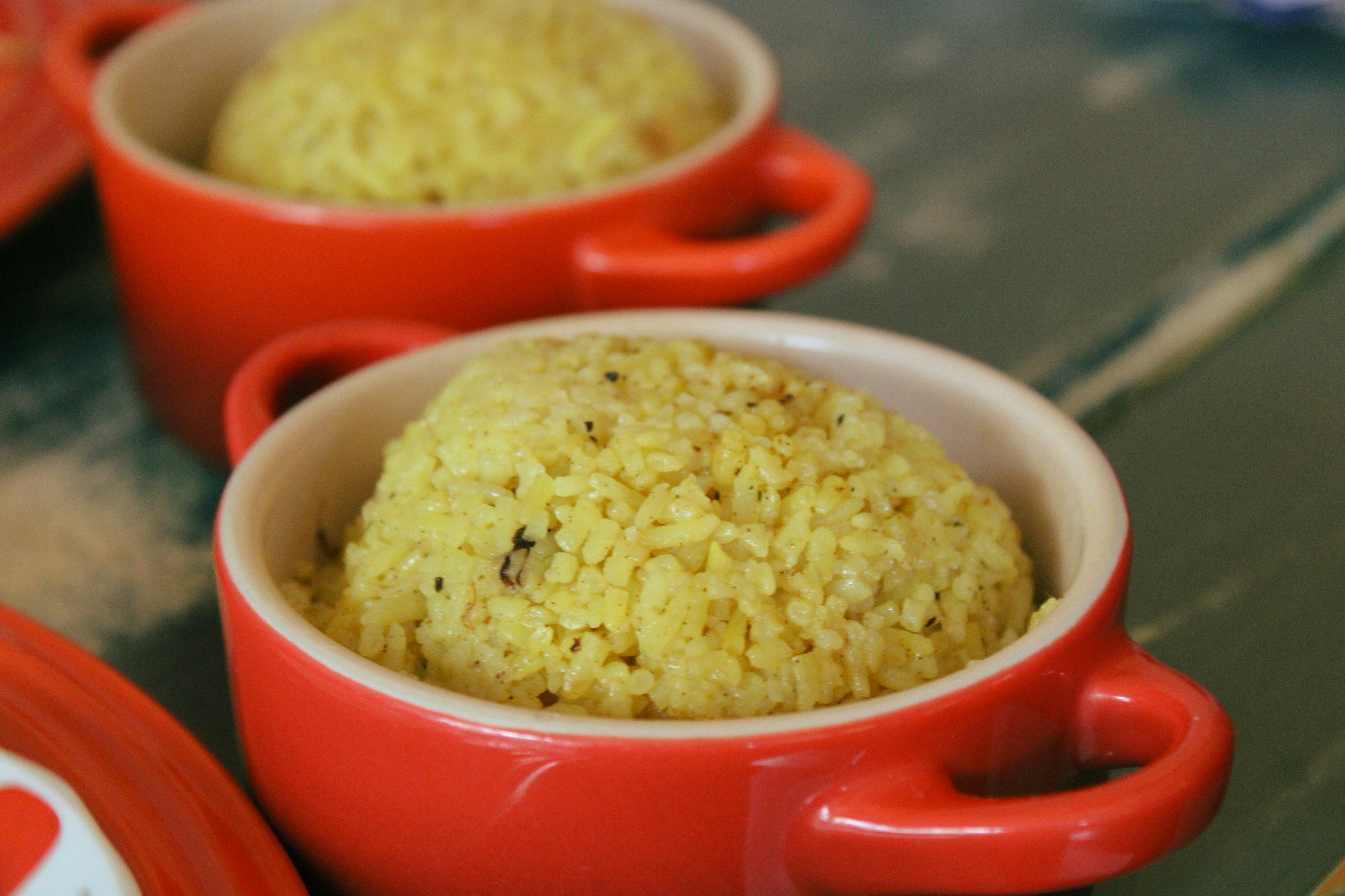 Golden Bites in Red Dishes: Aromatic Rice Entrées with a Cozy Tabletop Glow