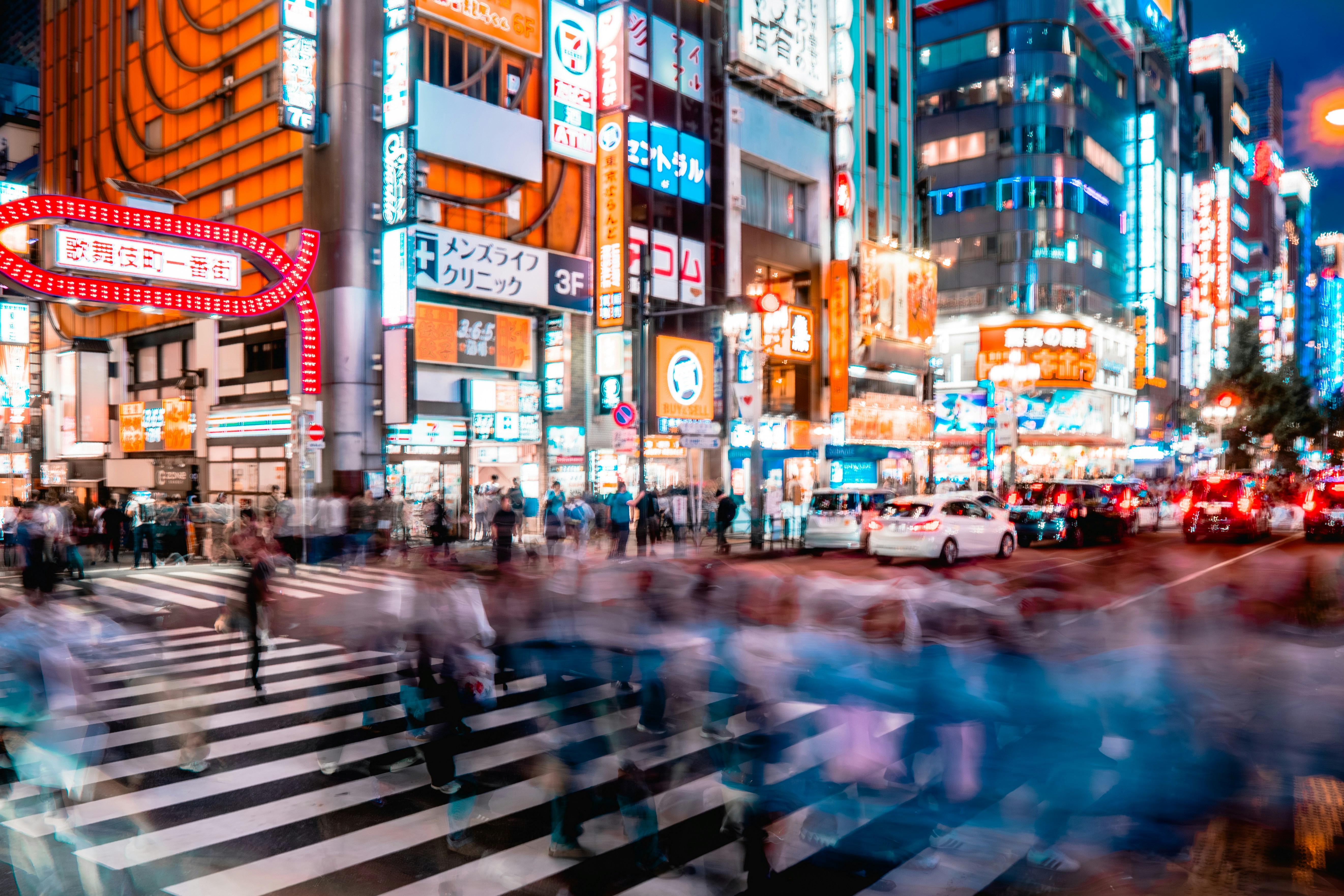 Neon Crossroad: People in Motion Amid Tokyo’s Night Pulse