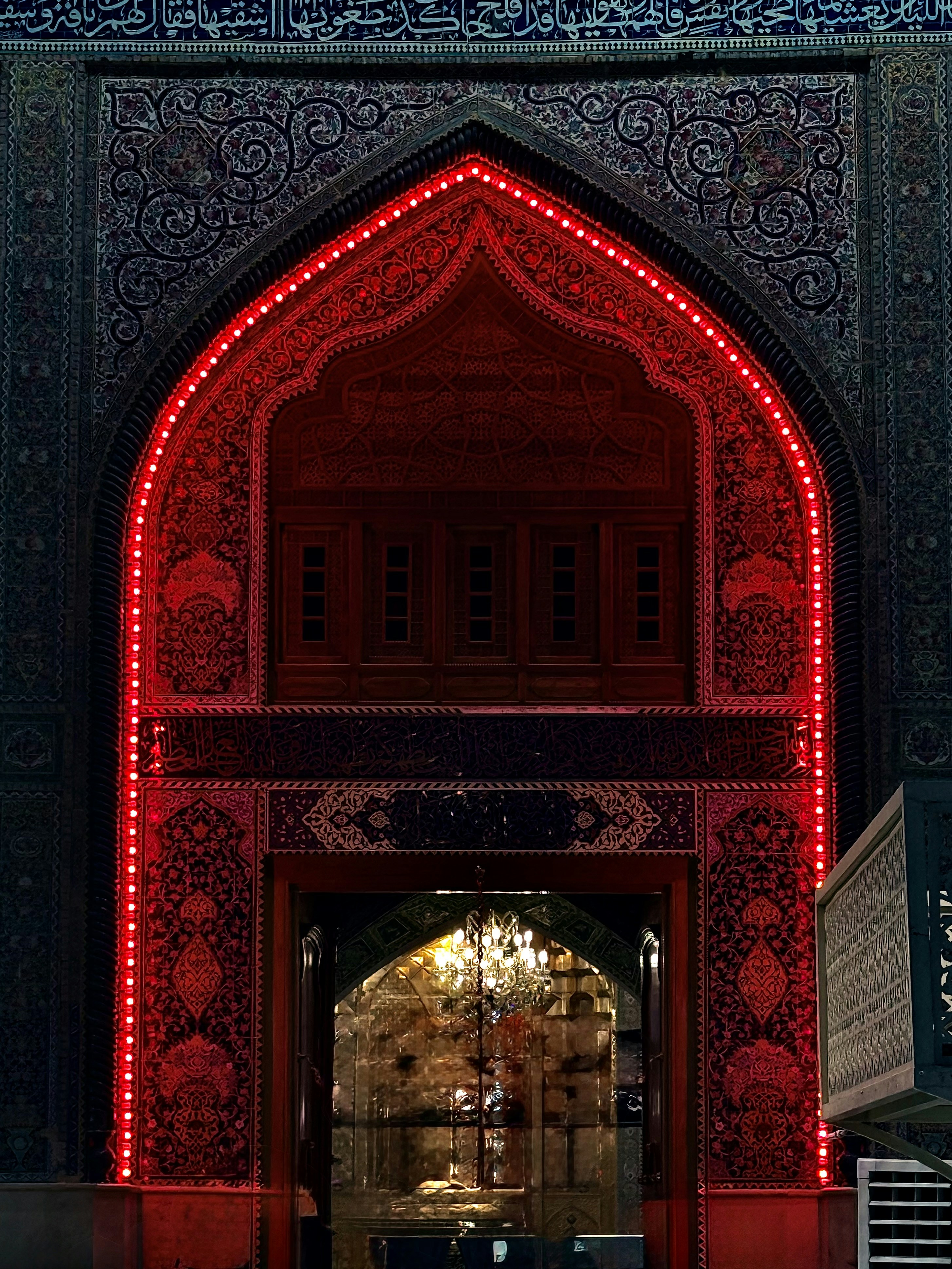 Neon Archway: A Night Portrait of Red Ornamental Gate