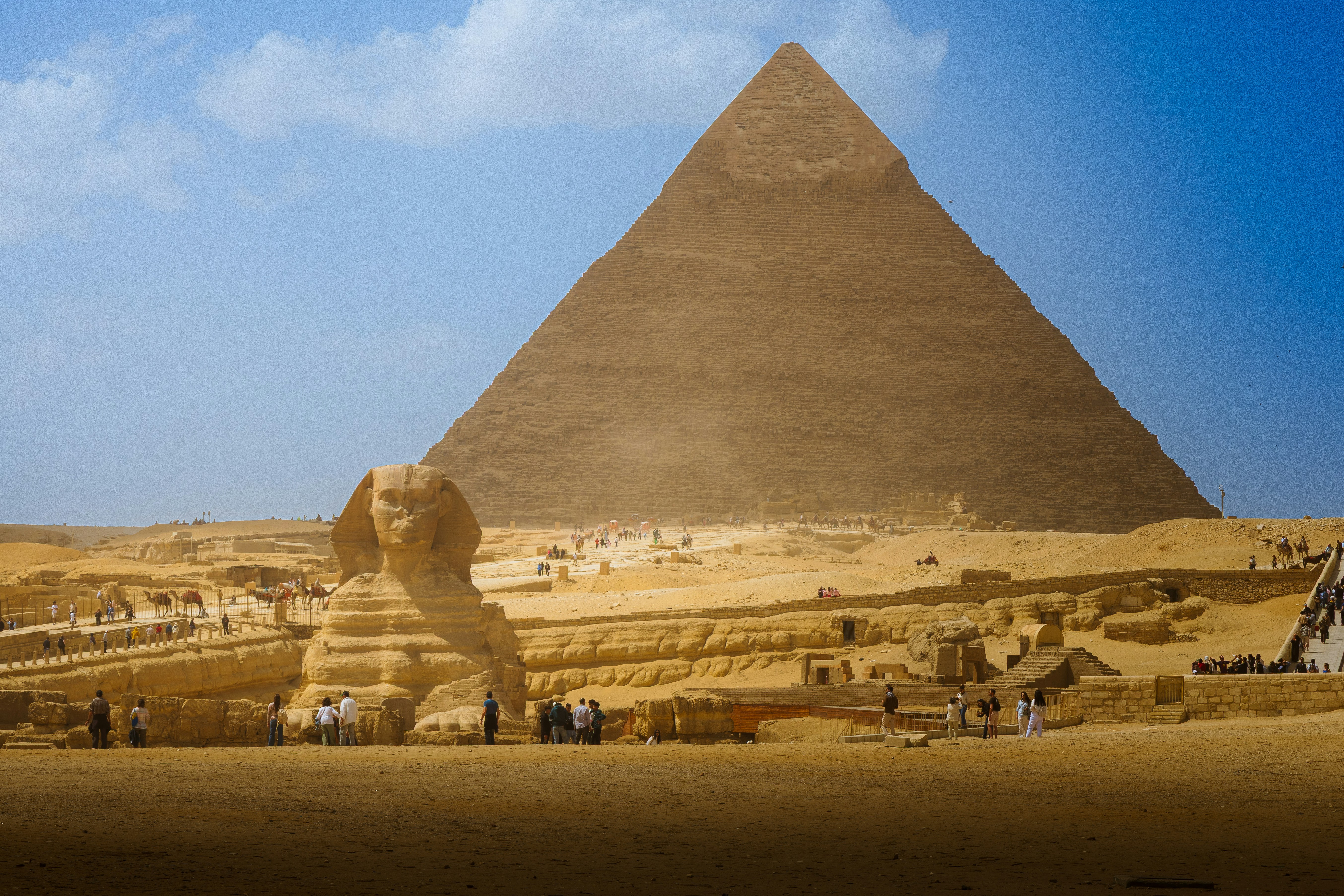 The Great Pyramid and Sphinx at Dusk: Timeless Monuments on a Desert Stage