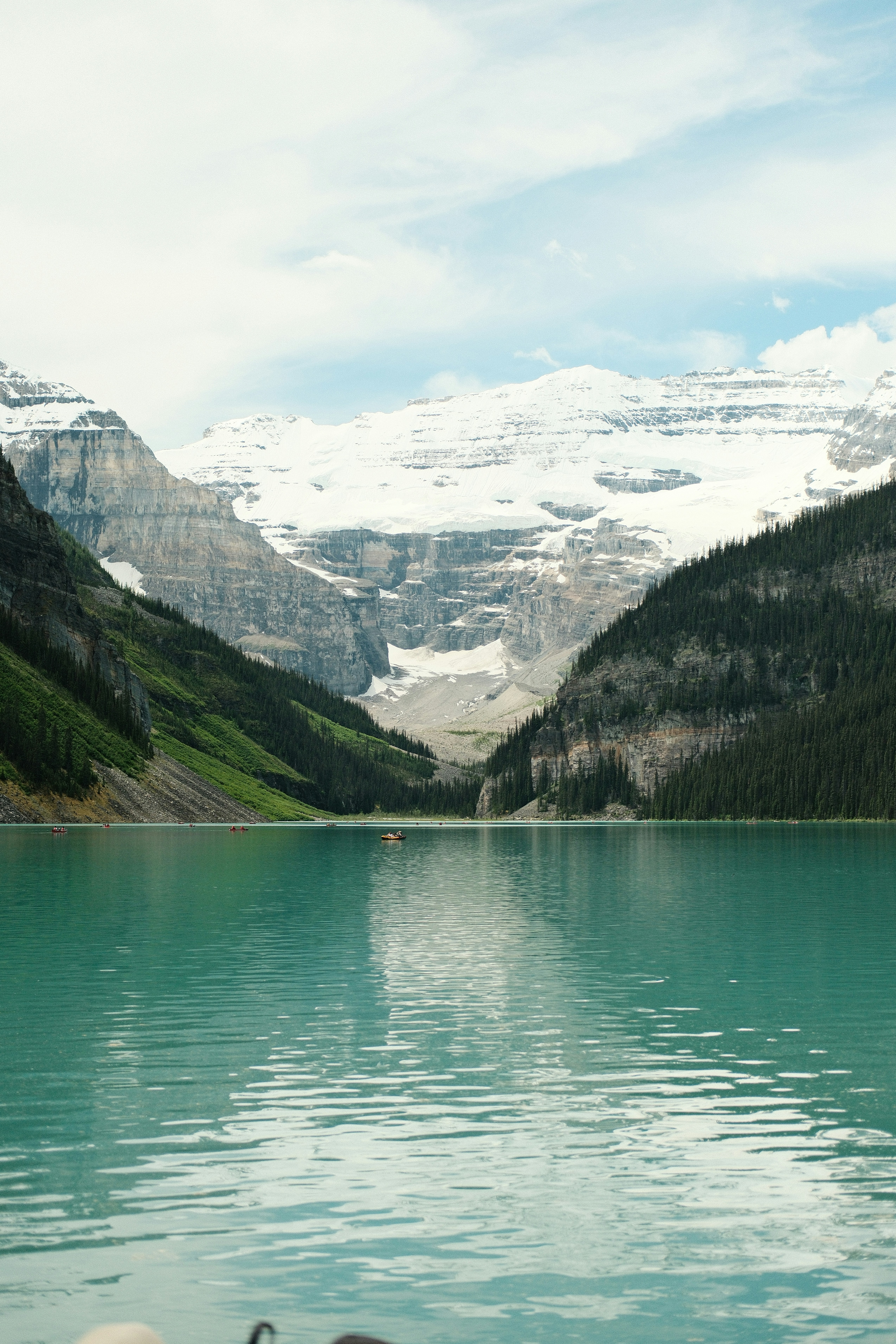Emerald Quiet: Snow-Capped Peaks Reflected in Glacier-Tongue Lake