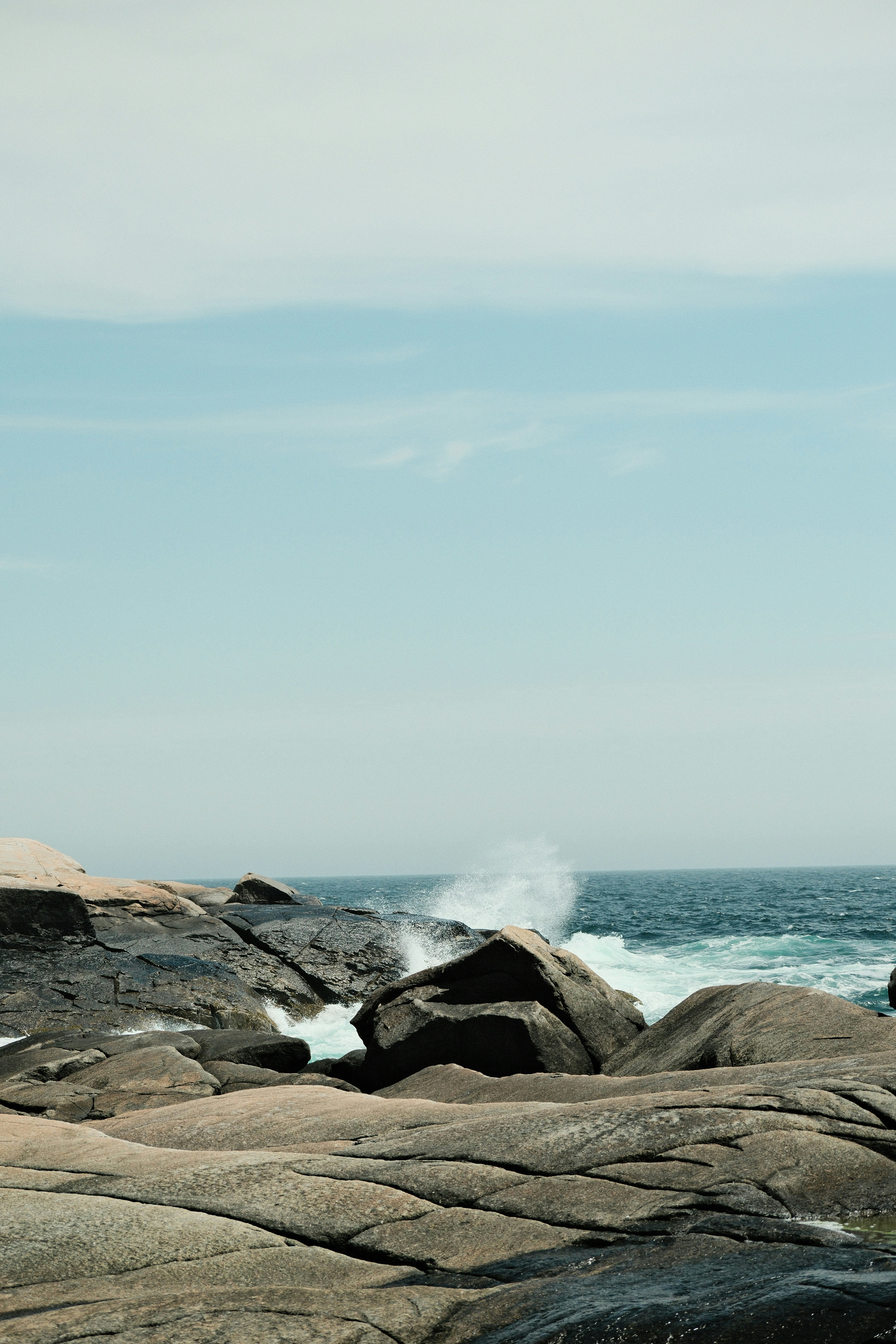 Coastal Granite: Waves Whisper Over Tidal Bedrock
