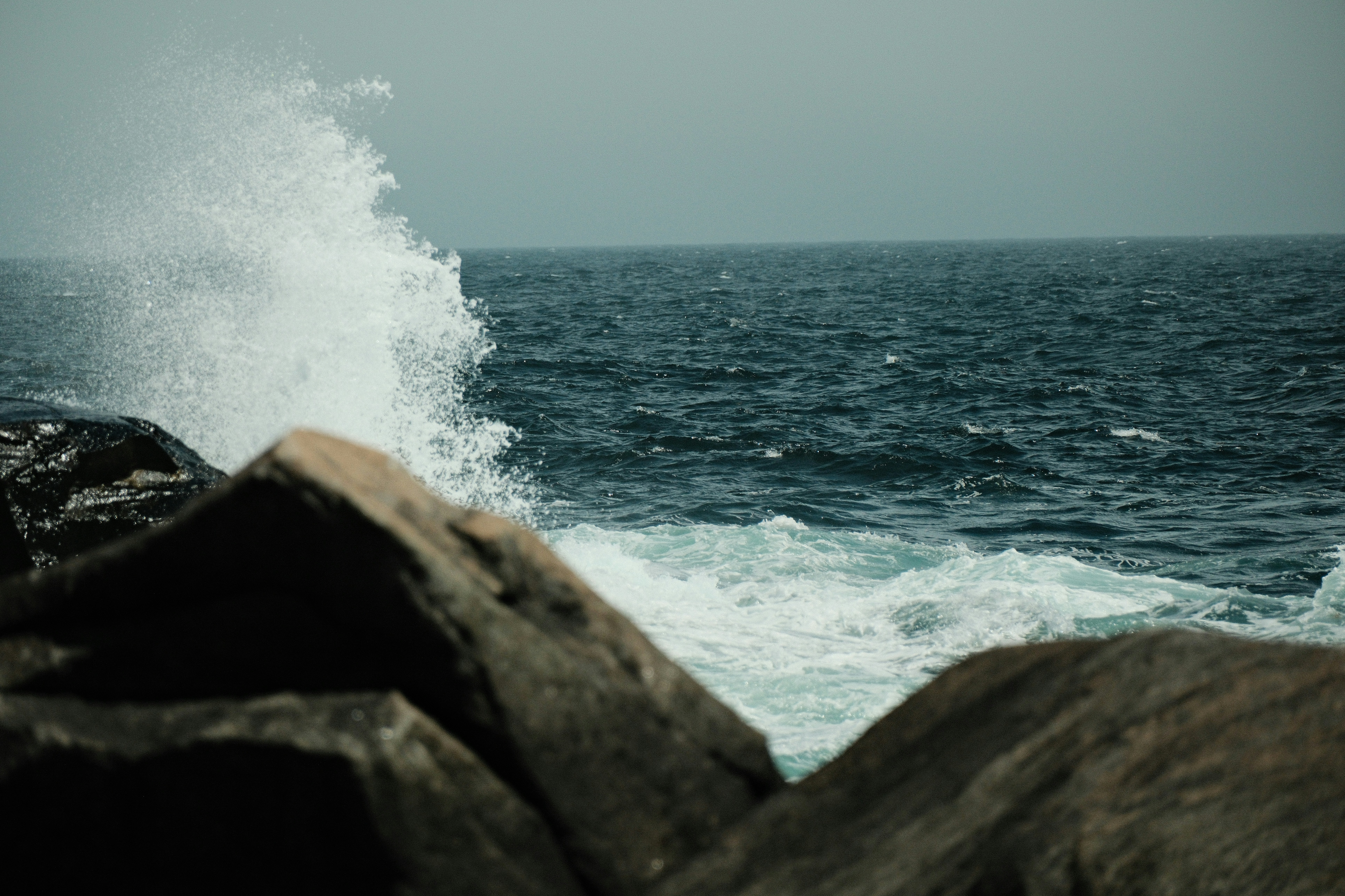 Rough Sea Meeting the Shadowed Rocks