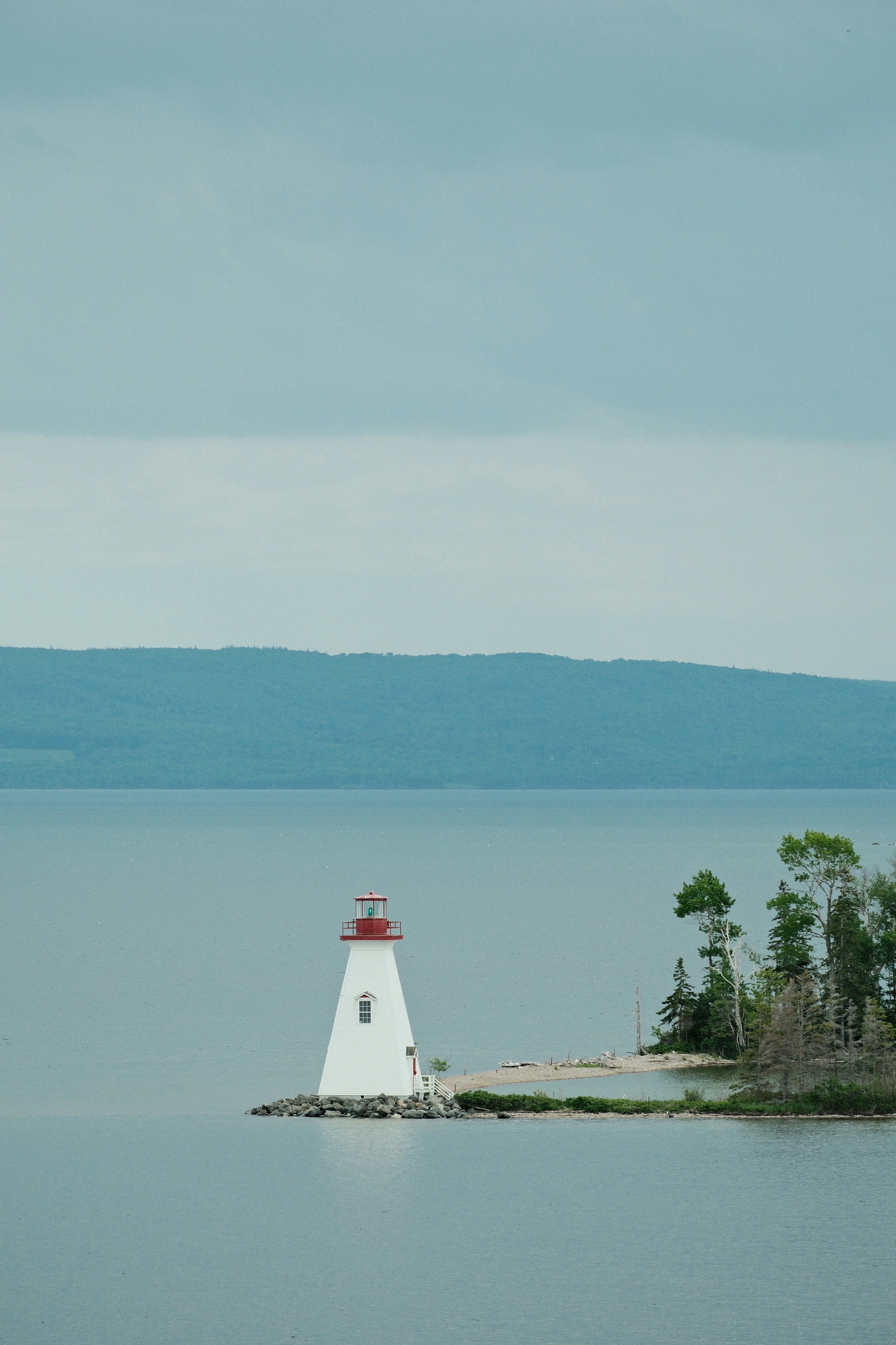 Lighthouse at the Quiet Edge of the Lake