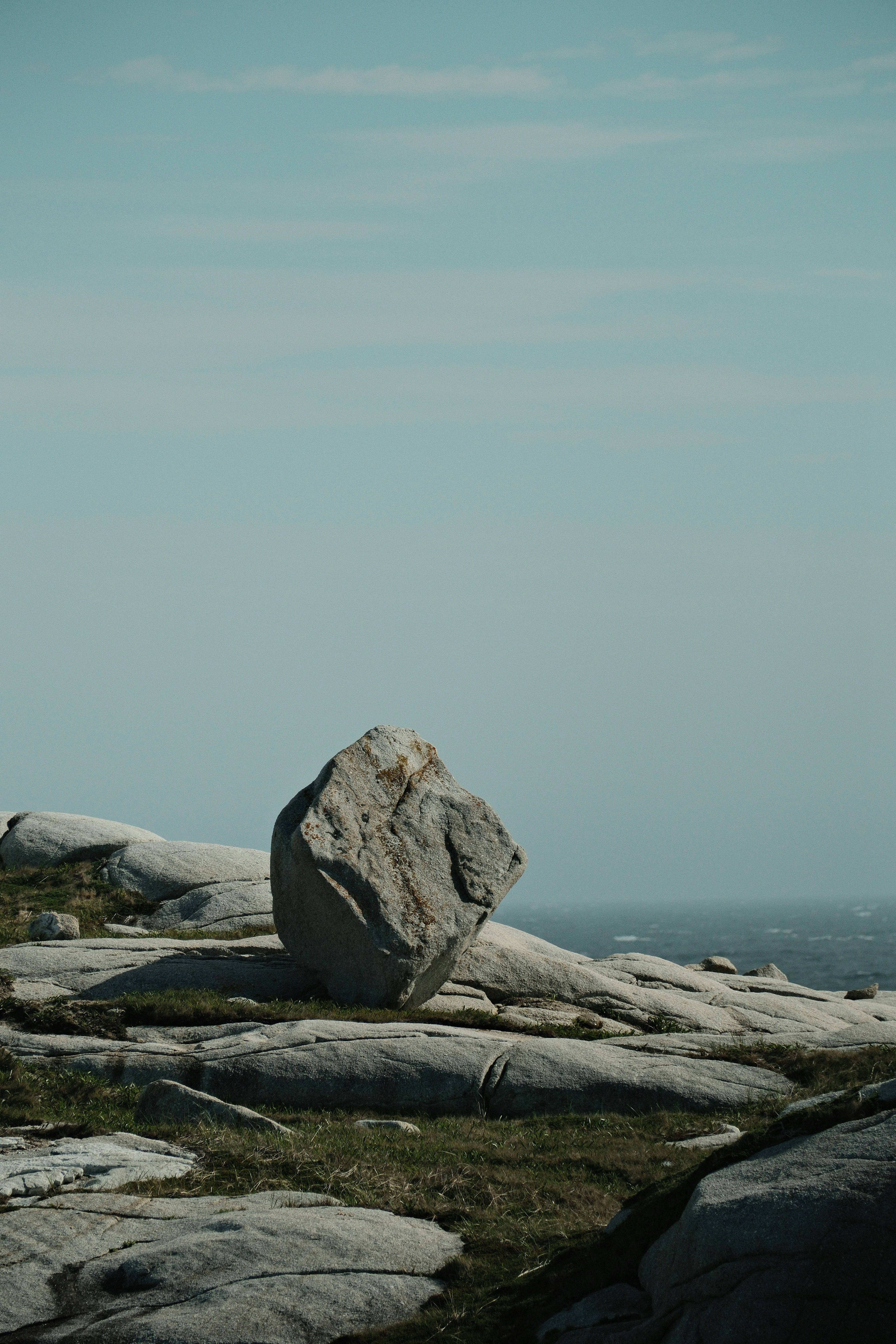 Balancing Stone: A Lone Boulder on a Quiet Coastal Plain