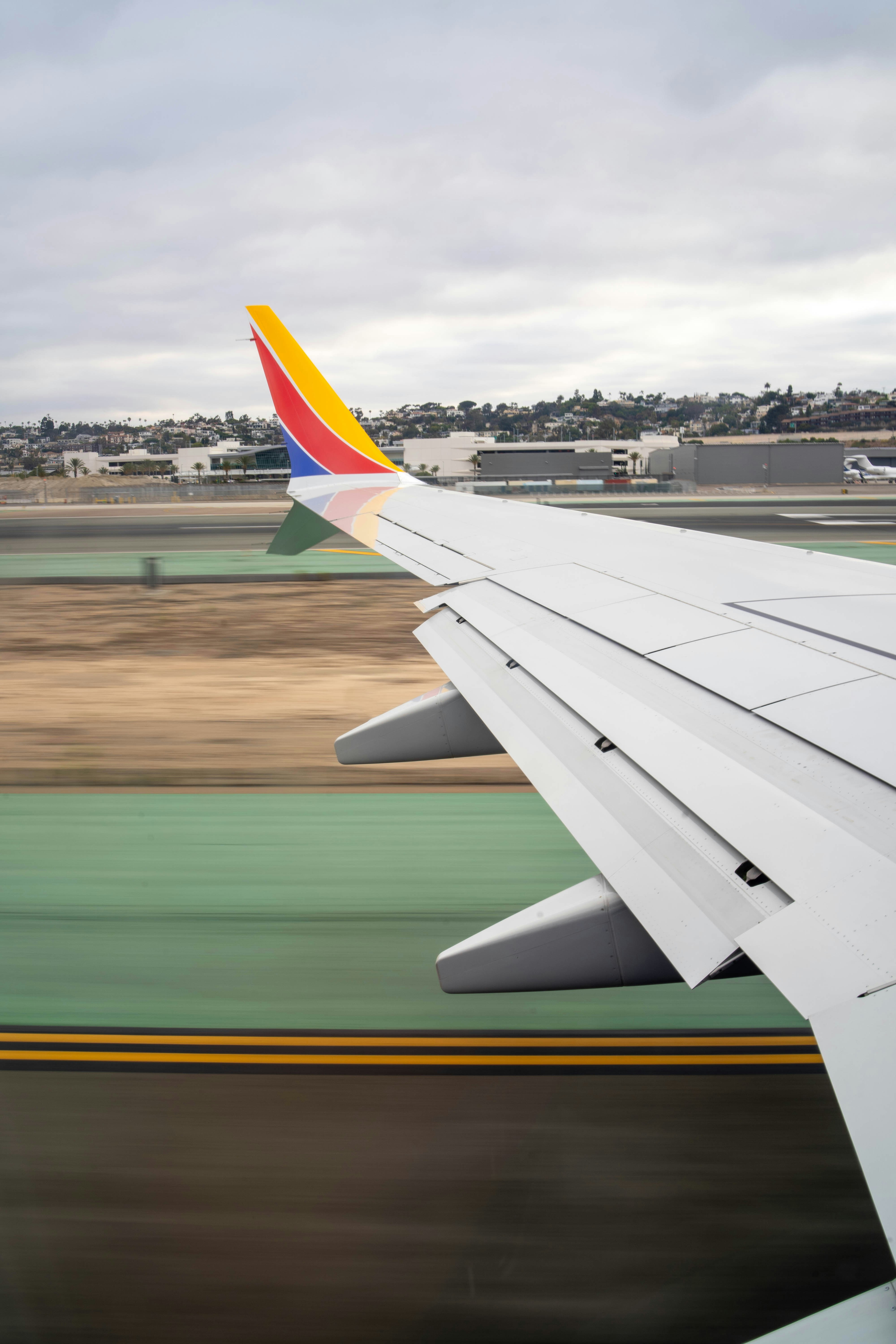 Wing in Flight: Quiet Power Over Runway Green