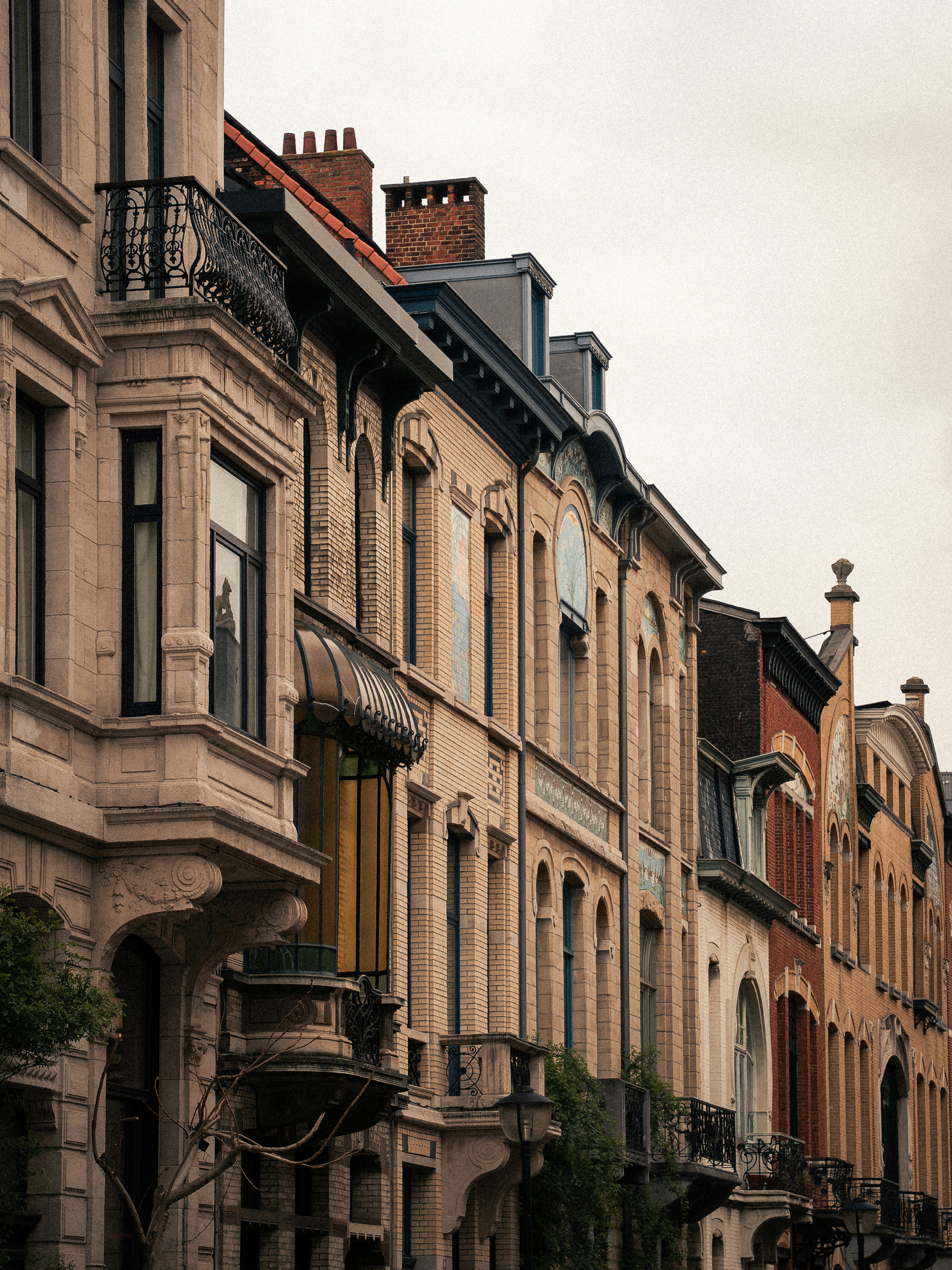 Row of urban townhouses under a softly overcast sky