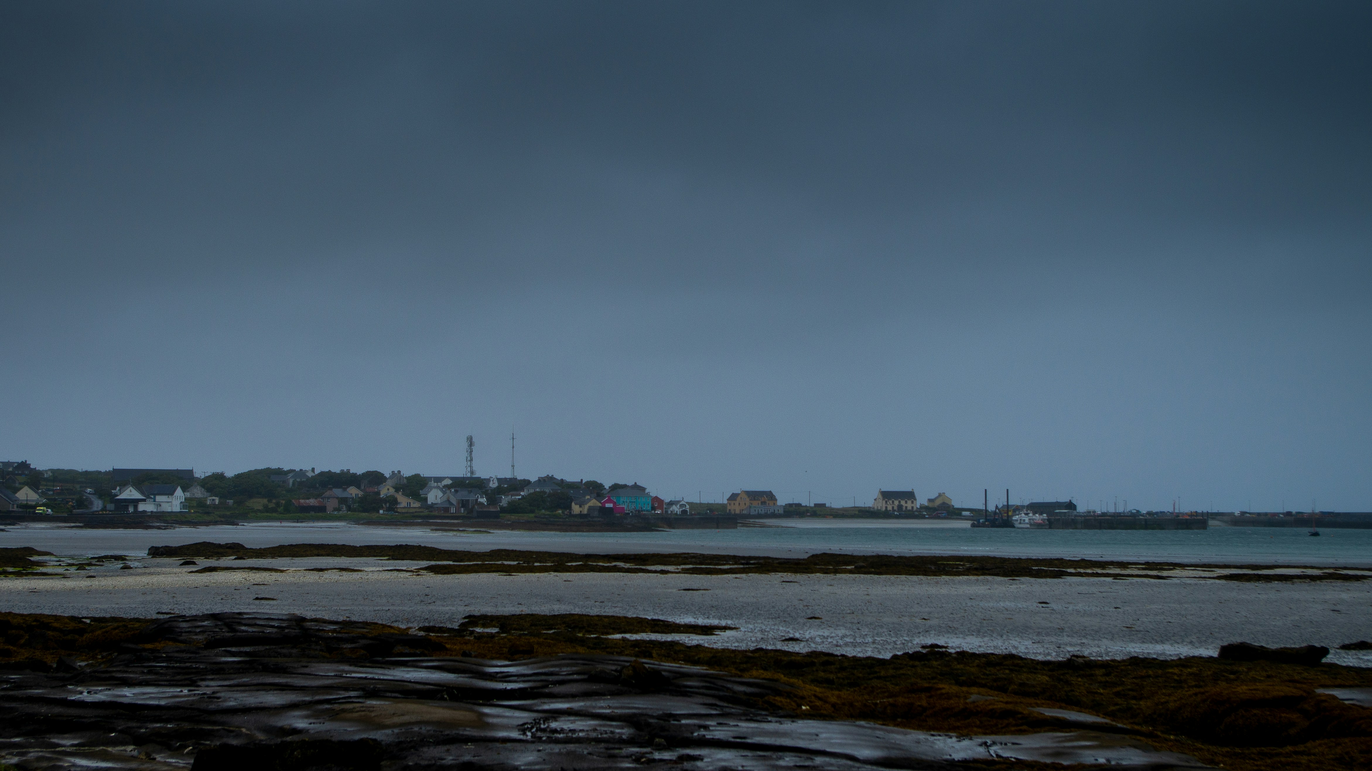 Coastal Horizon: Quiet Tide Beneath a Looming Sky