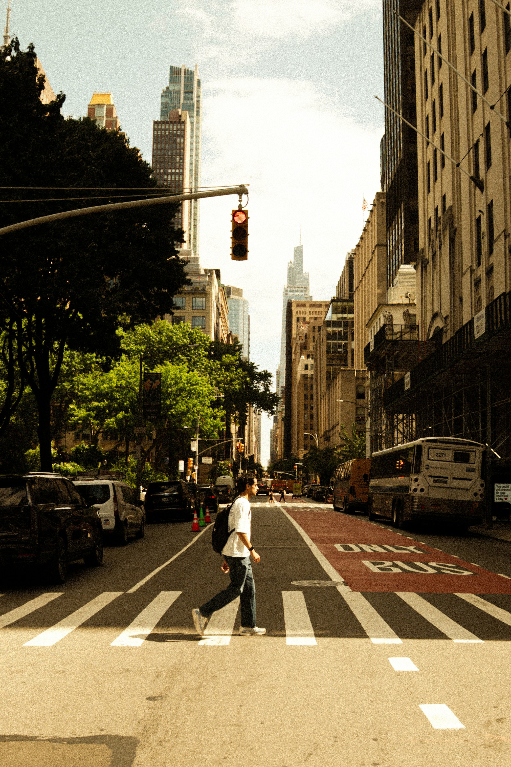 Crosswalk Moment: City Pulse in Afternoon Light