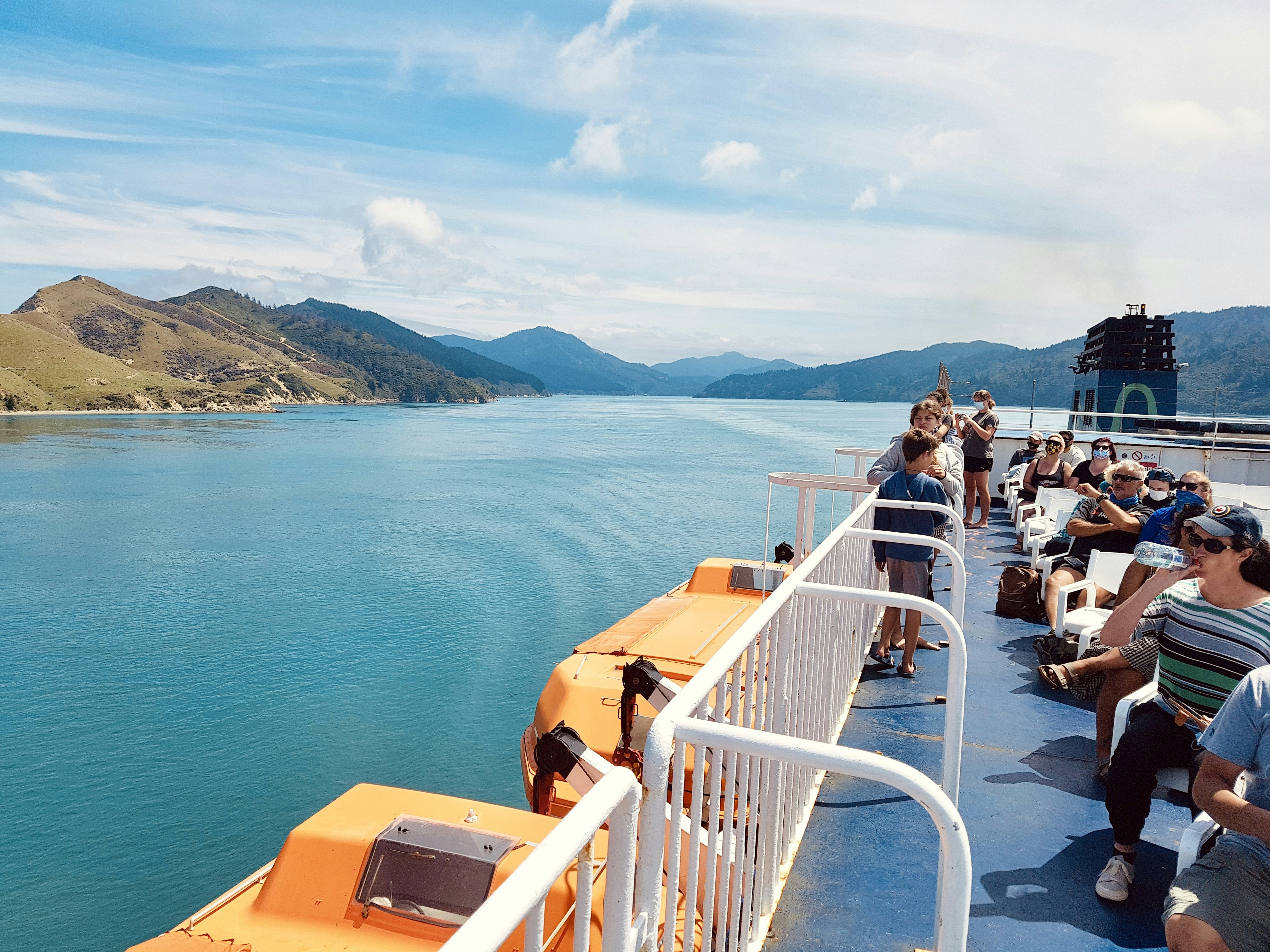 Sunlit Passenger Deck Gazing Across a Serene Reservoir