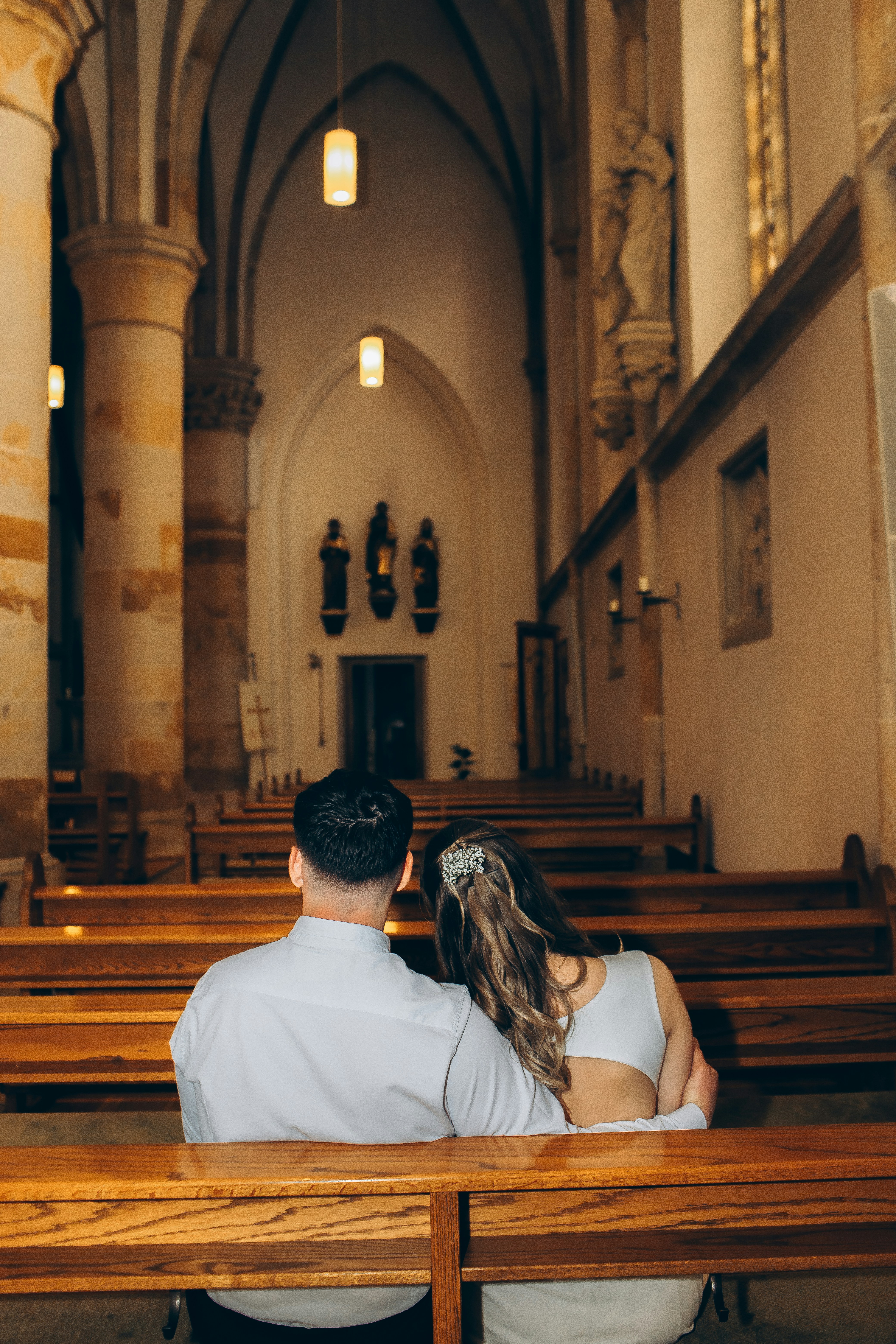Couple in the Aisle: Quiet Vows Under Cathedral Arches