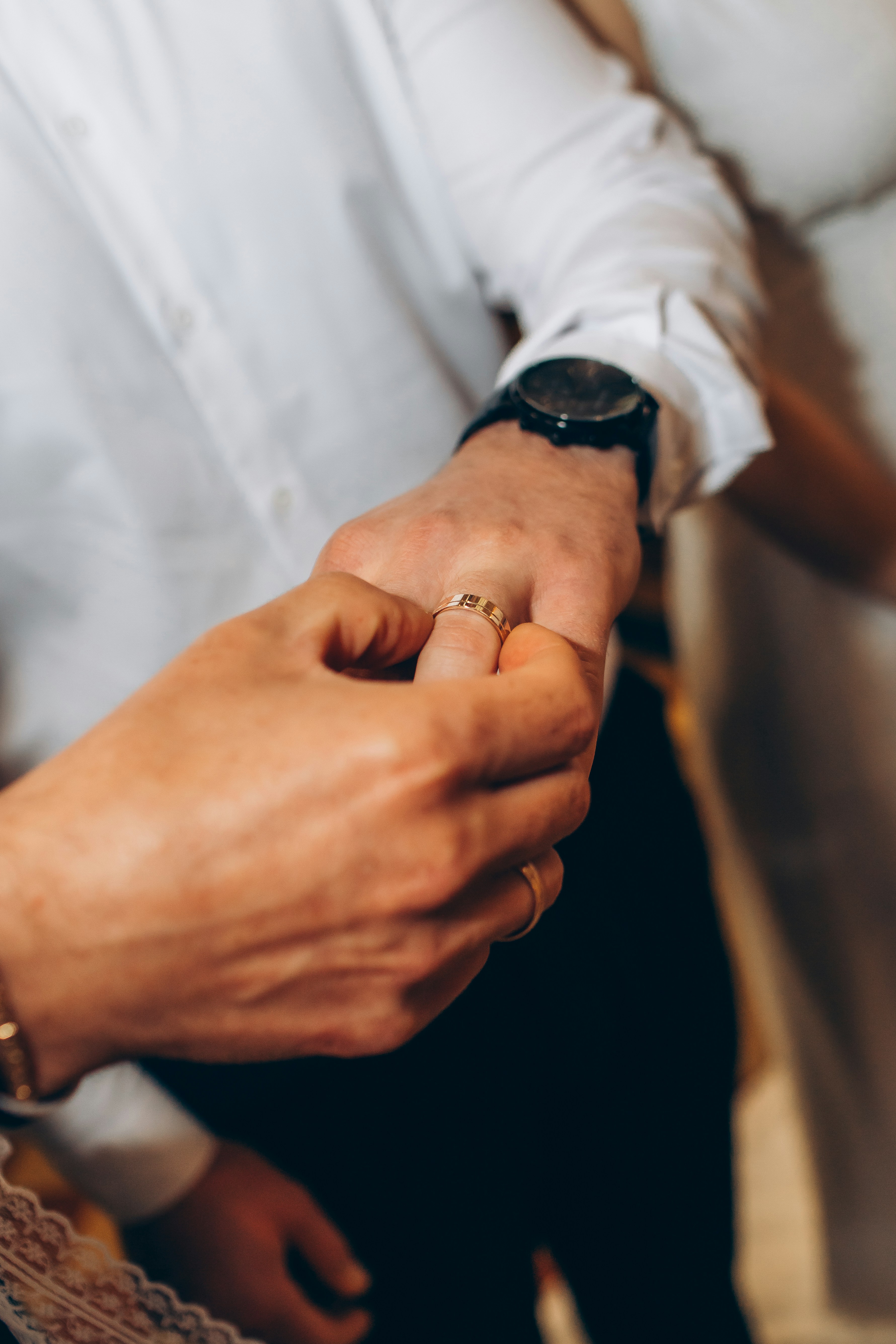 Hands of Ceremony: A Groom Adjusts His Ring