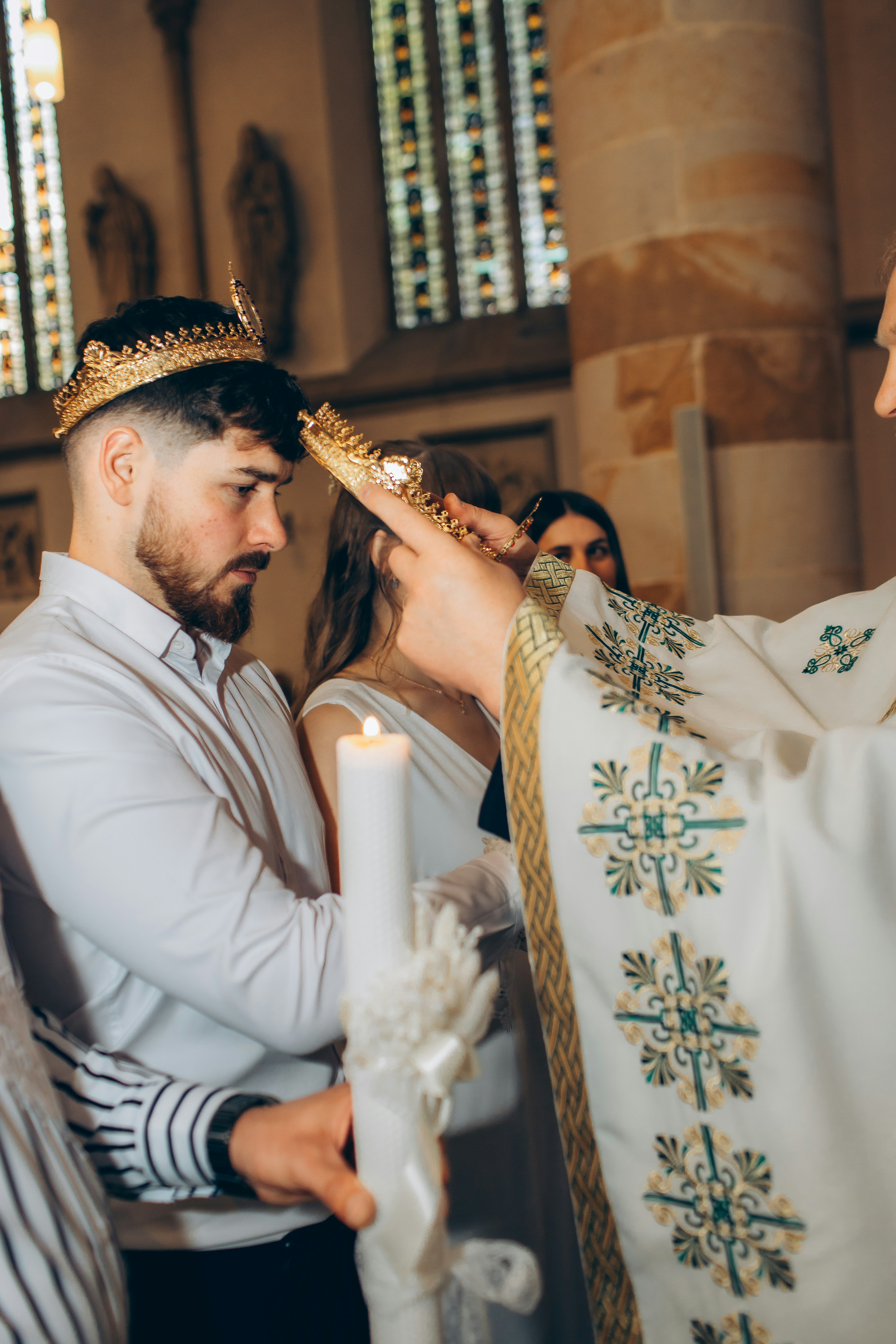 Crowning a Moment: A Sacred Exchange under Golden Crowns