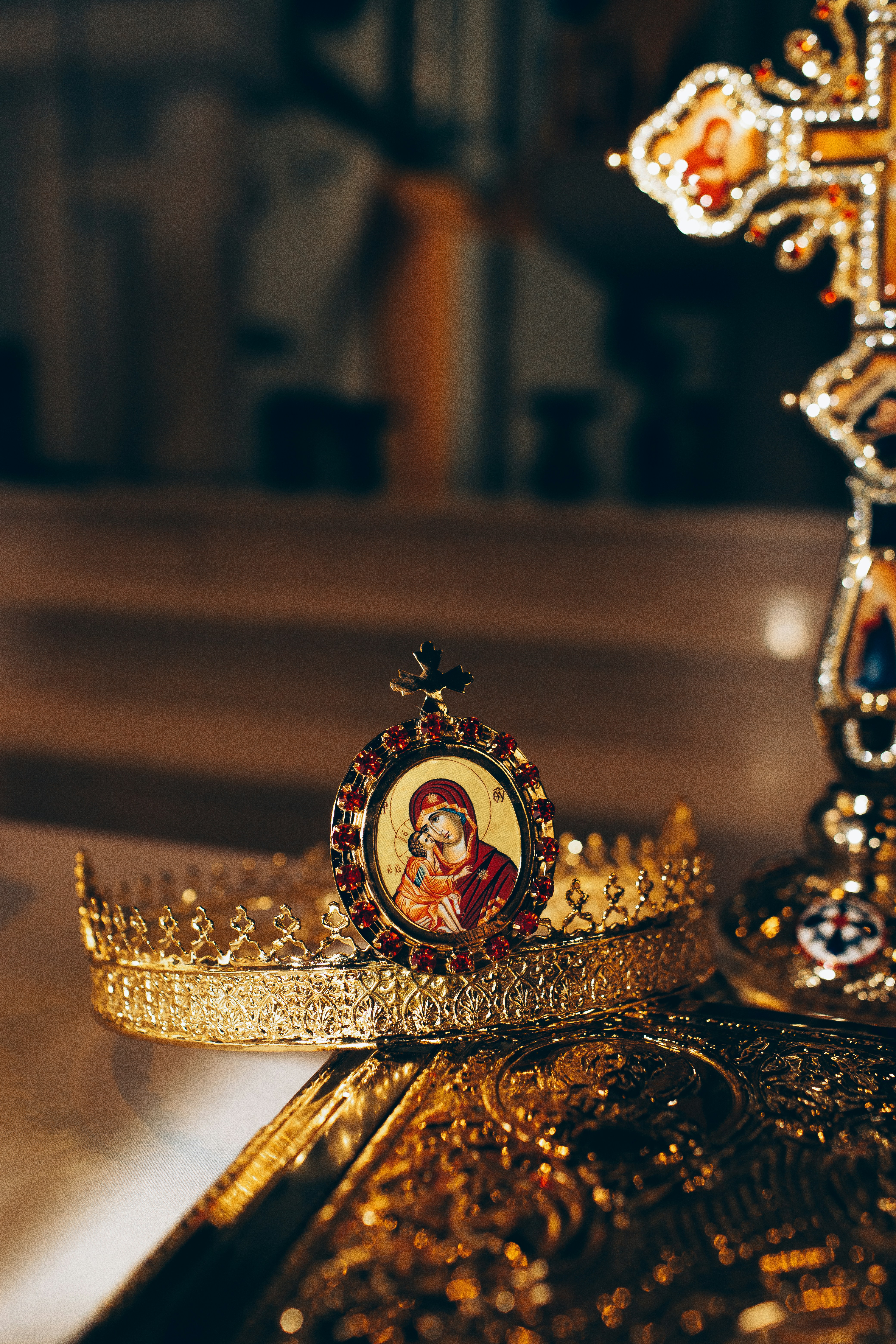 Golden Crown, Quiet Reverence: A Religious Keepsake in Soft Spotlight