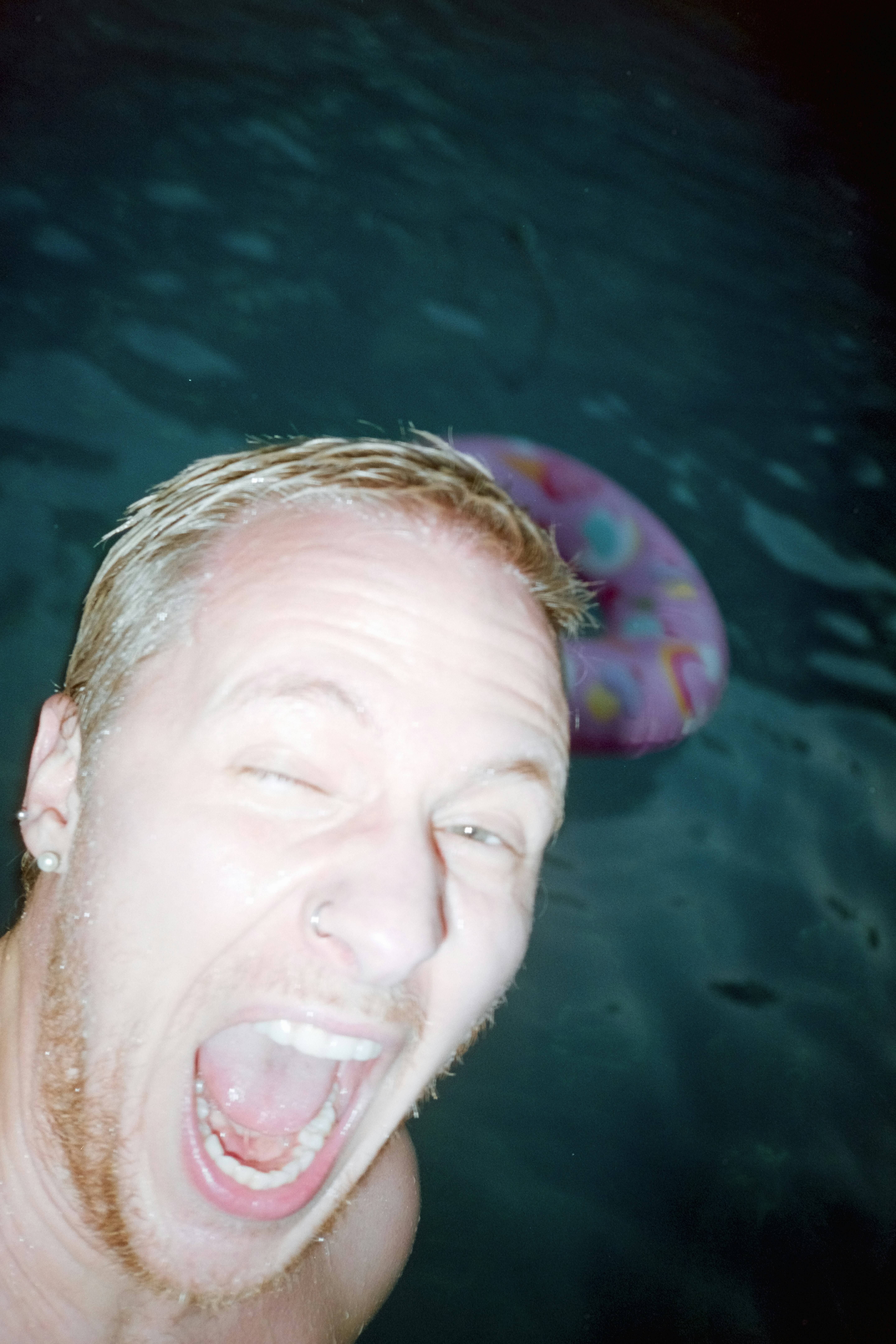 Joyride at Sea: A Laughing Splash Under Neon Night