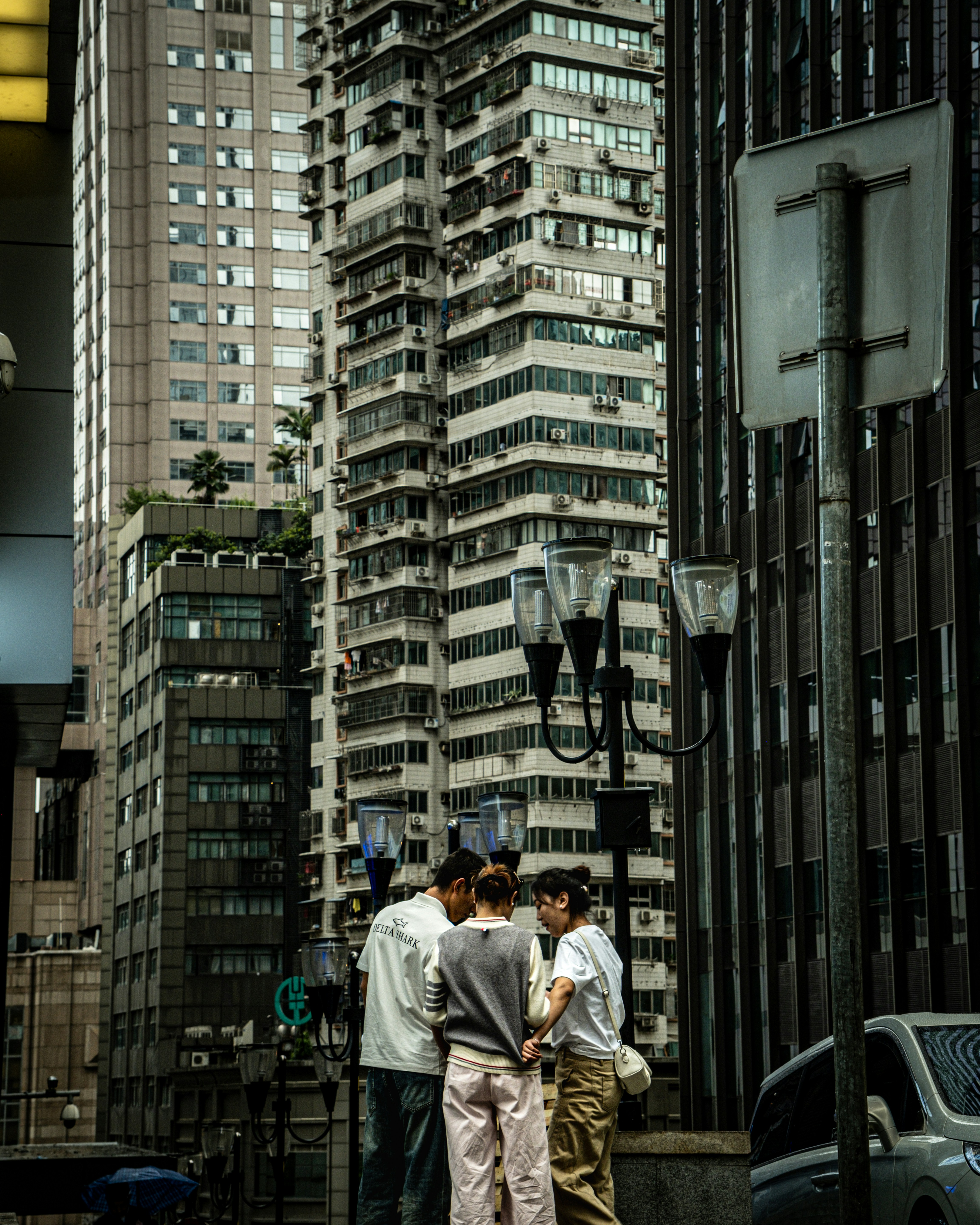 Urban Circle: Friends in Conversation Under a City Lantern