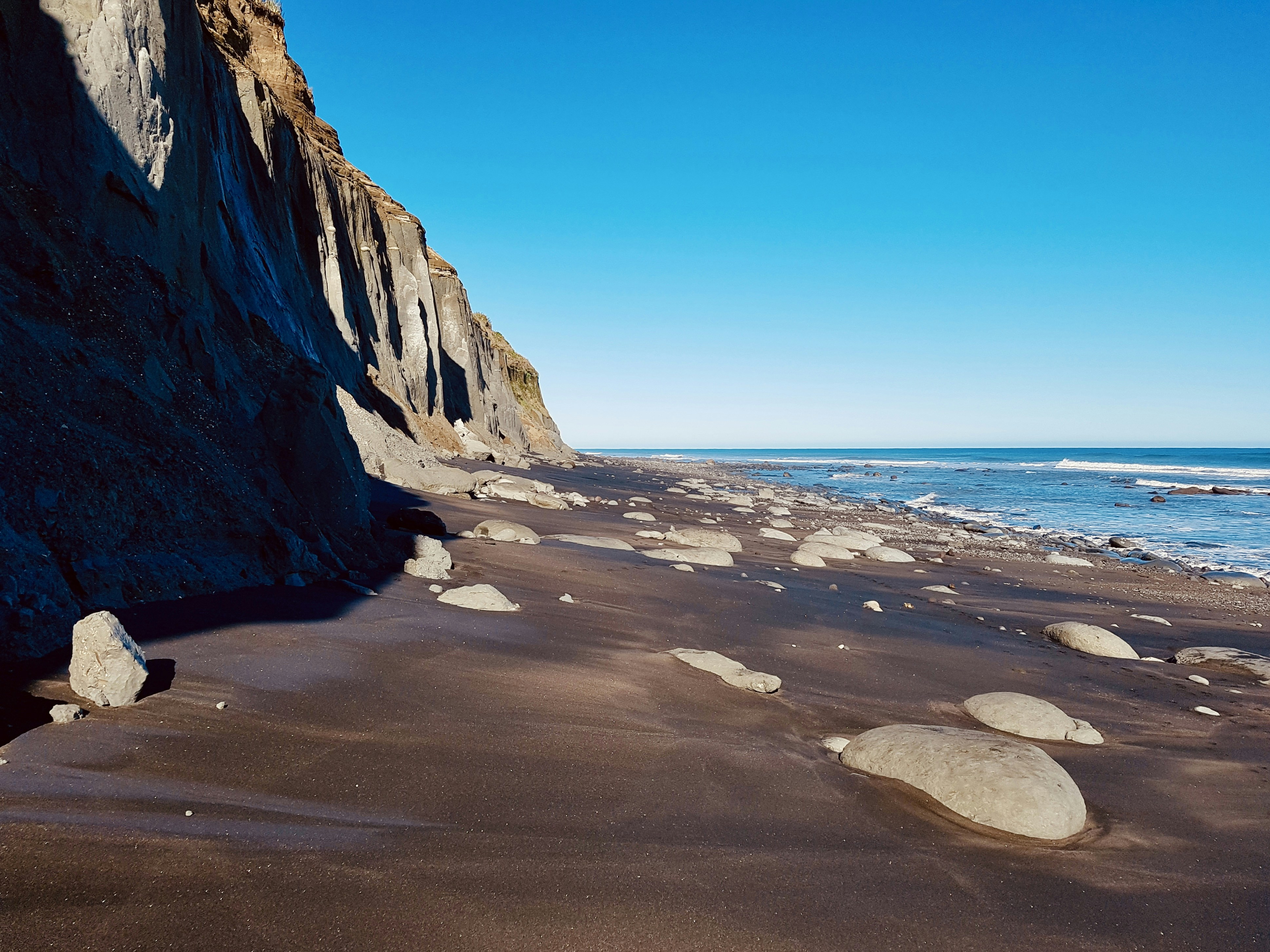 Clifftop Shoreline: Smooth Pebbles on a Quiet Beach