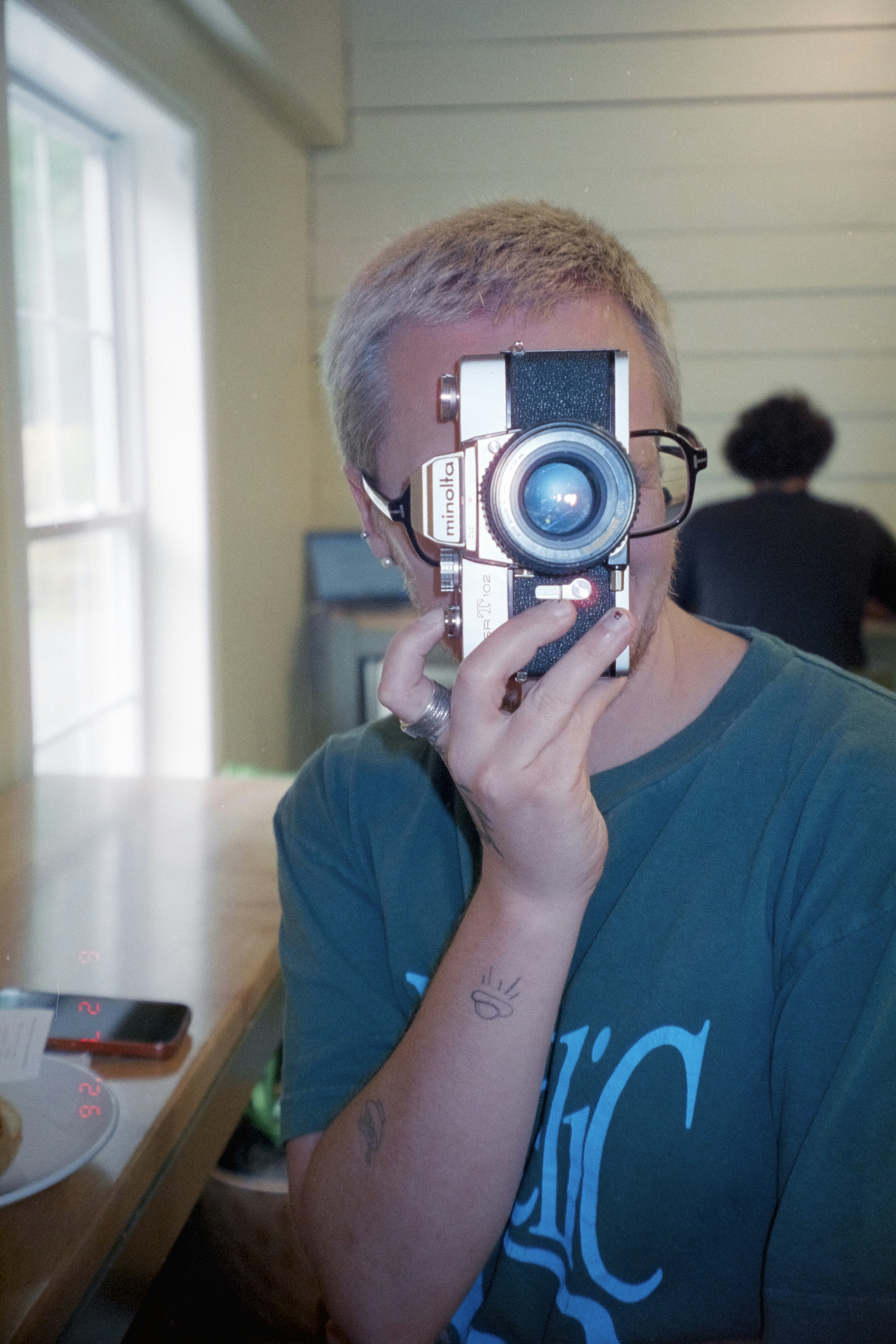 Through the Lens: A Candid Portrait with a Vintage Cam