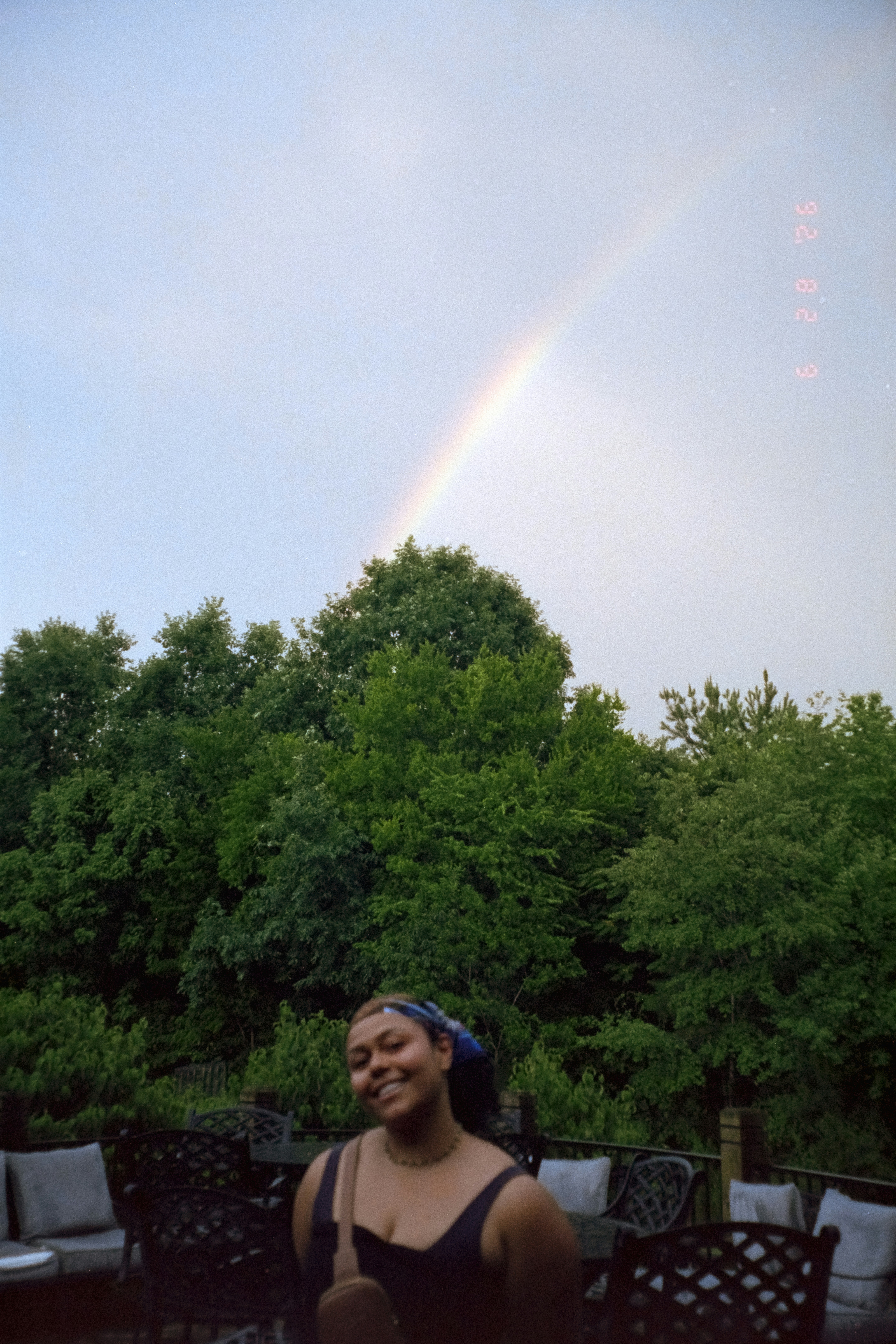 Rainbow Over Quiet Garden Portrait