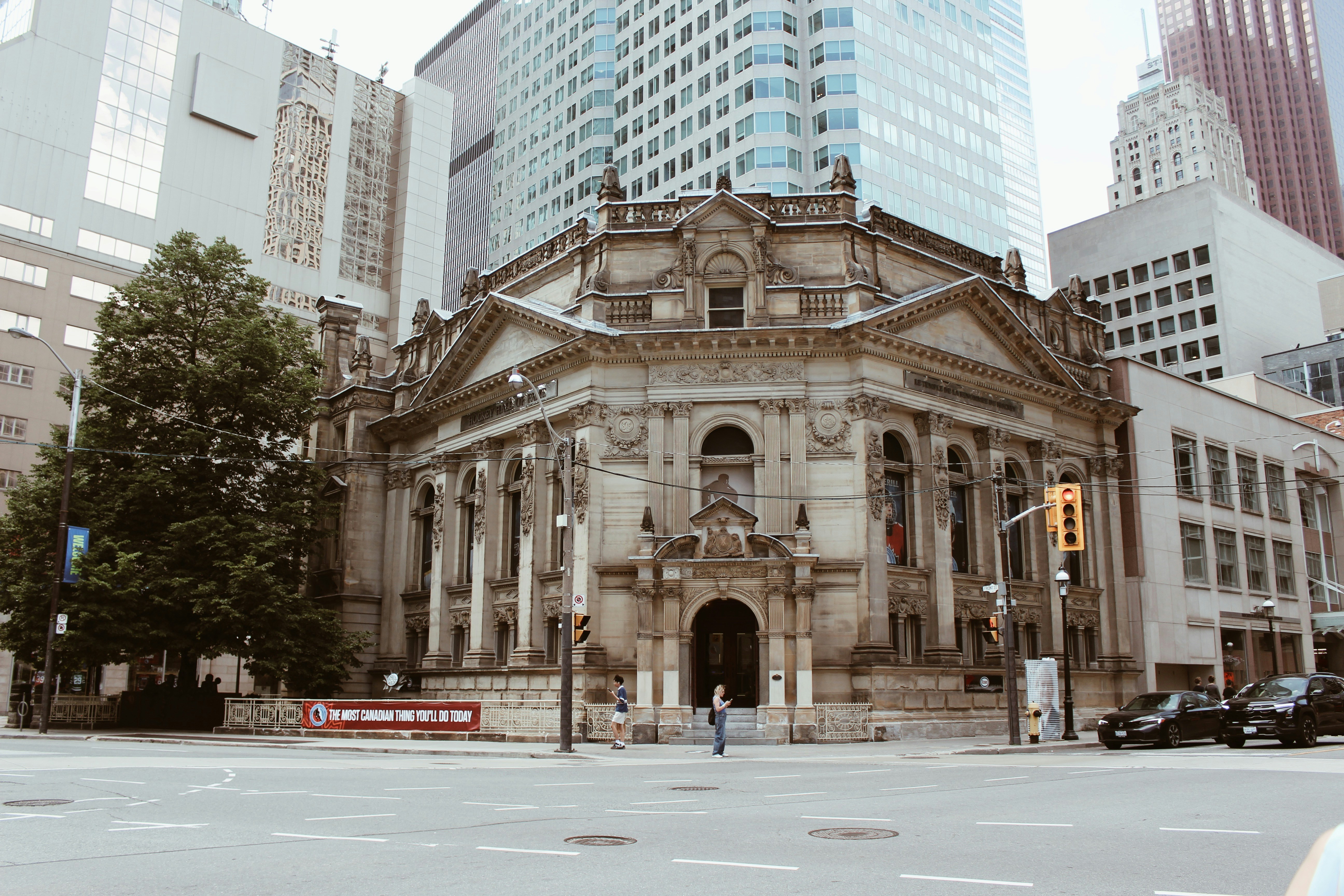 Stately Bank of a City Facade Amid Glass Skyscrapers