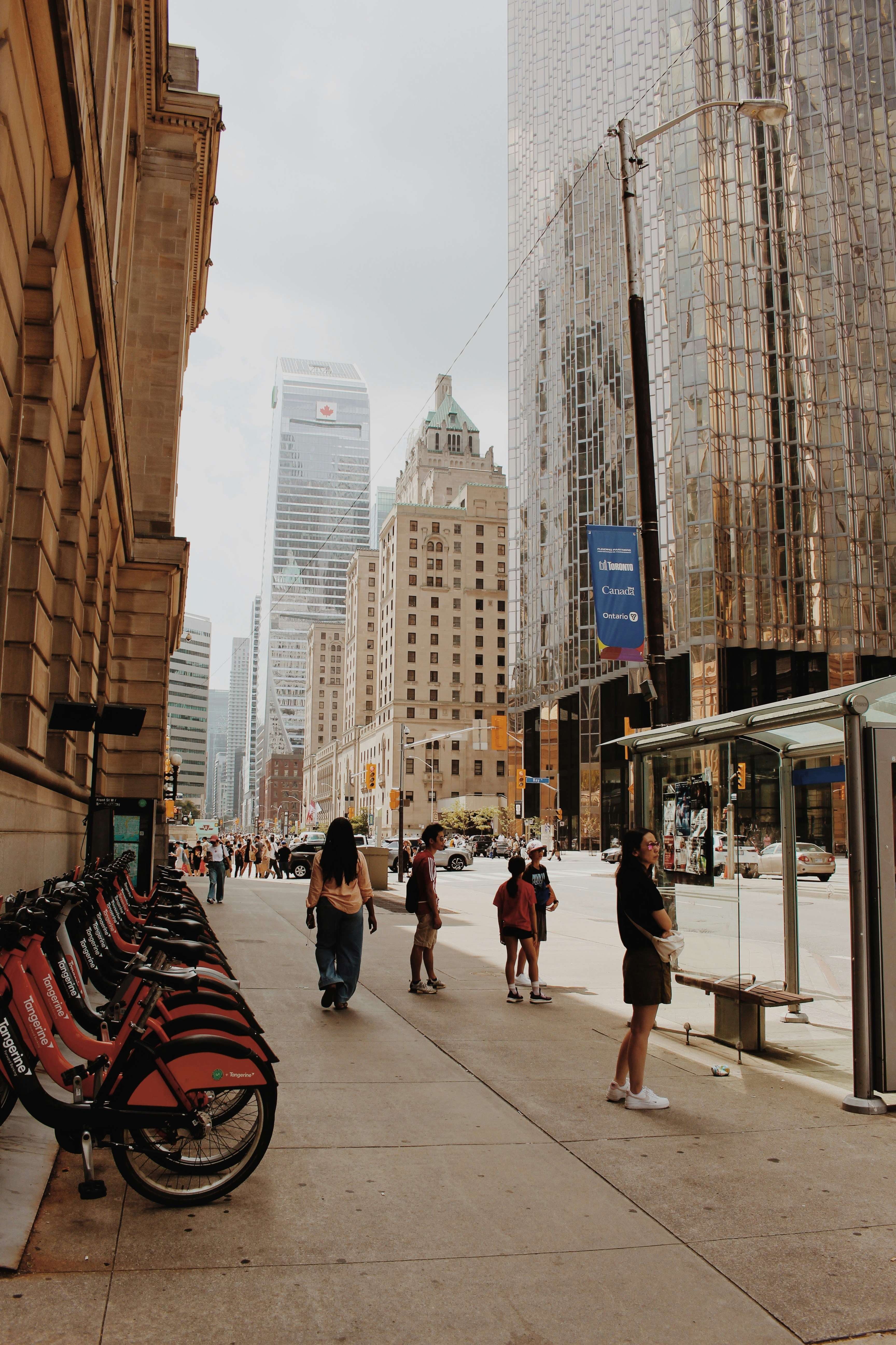 City Silhouette and People at a Bus Stop in a Modern Downtown
