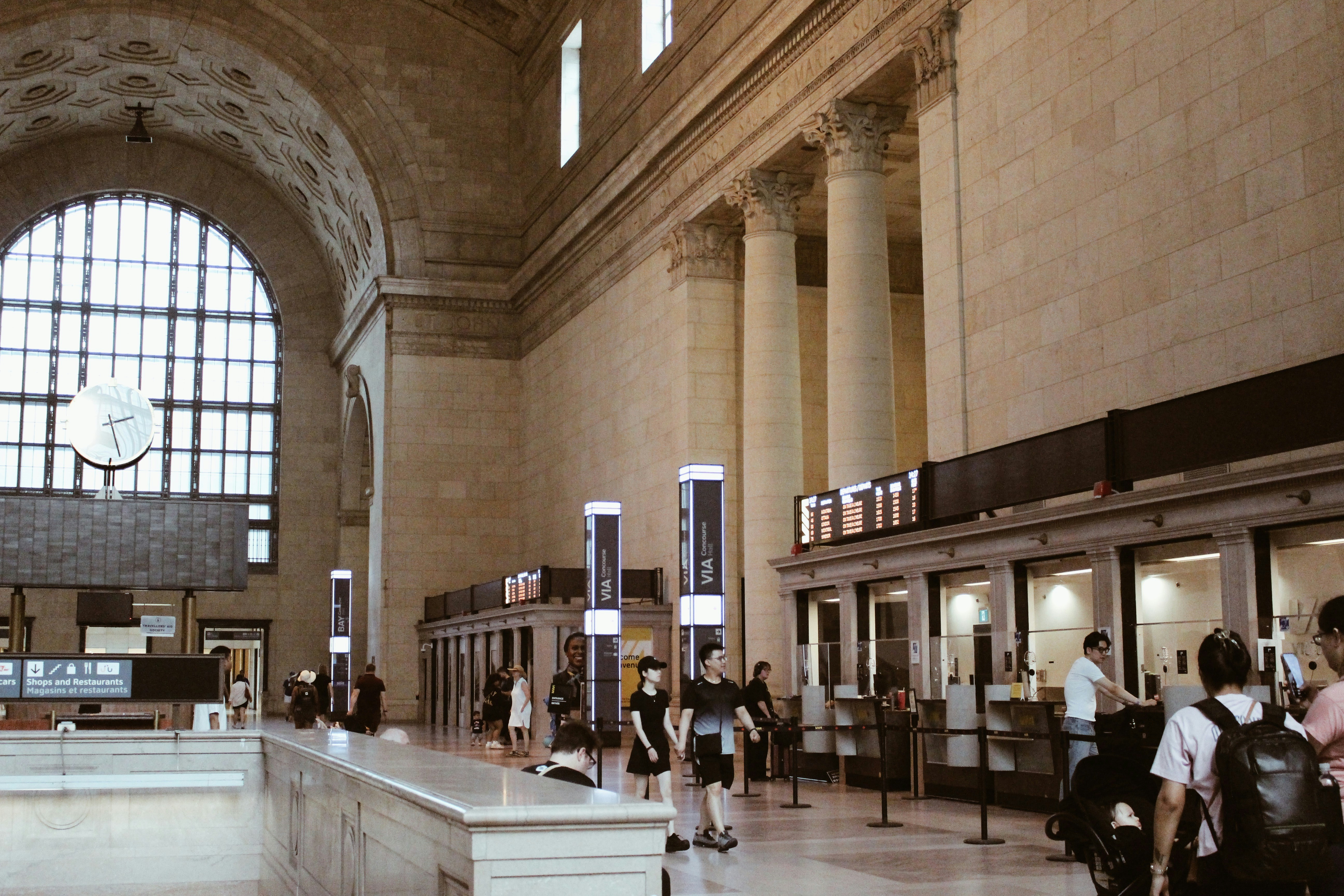 Timeless Departure: A Sunlit Hall of Stone and Glass
