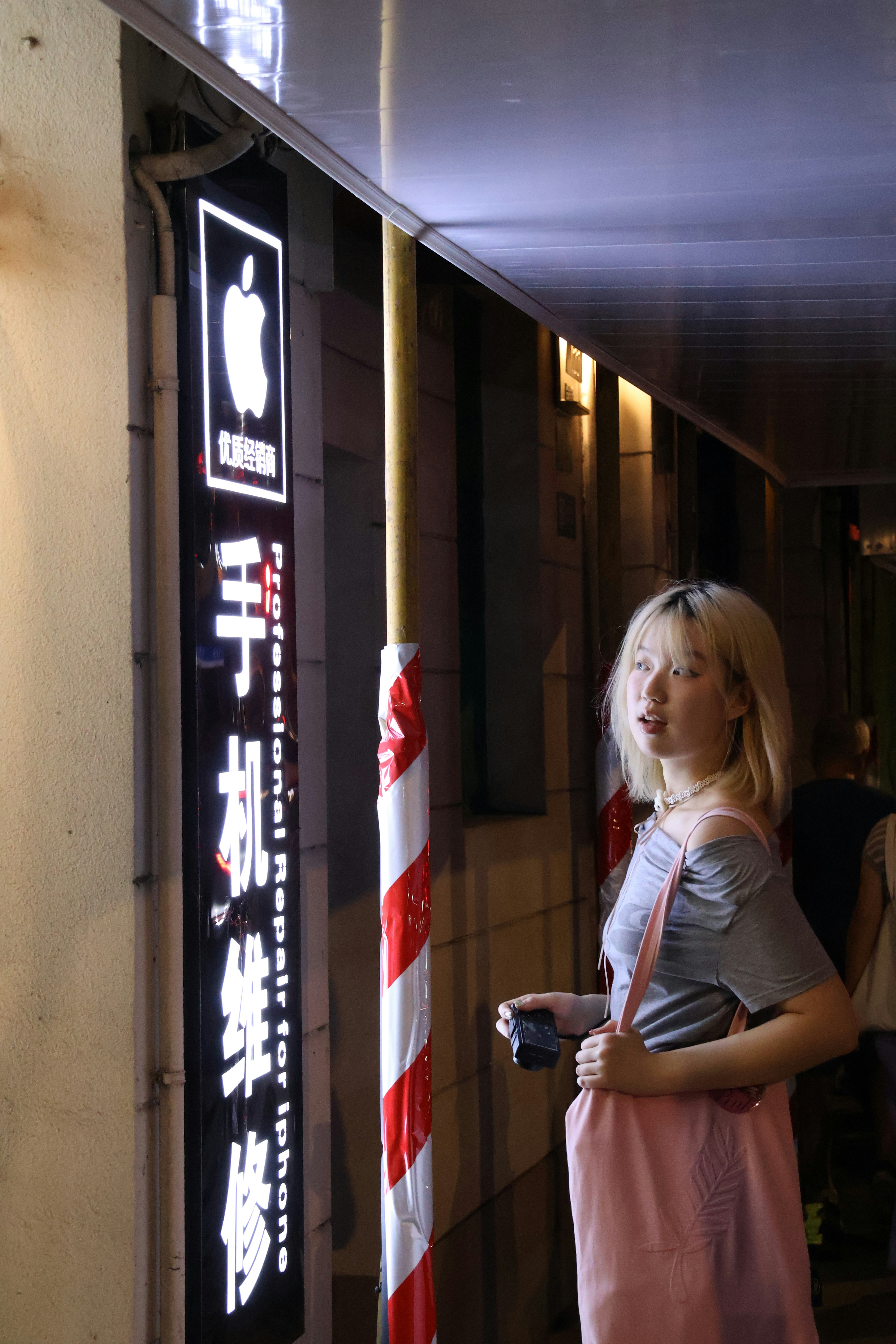 Neon Signage and Portrait in a Neon-lit Street