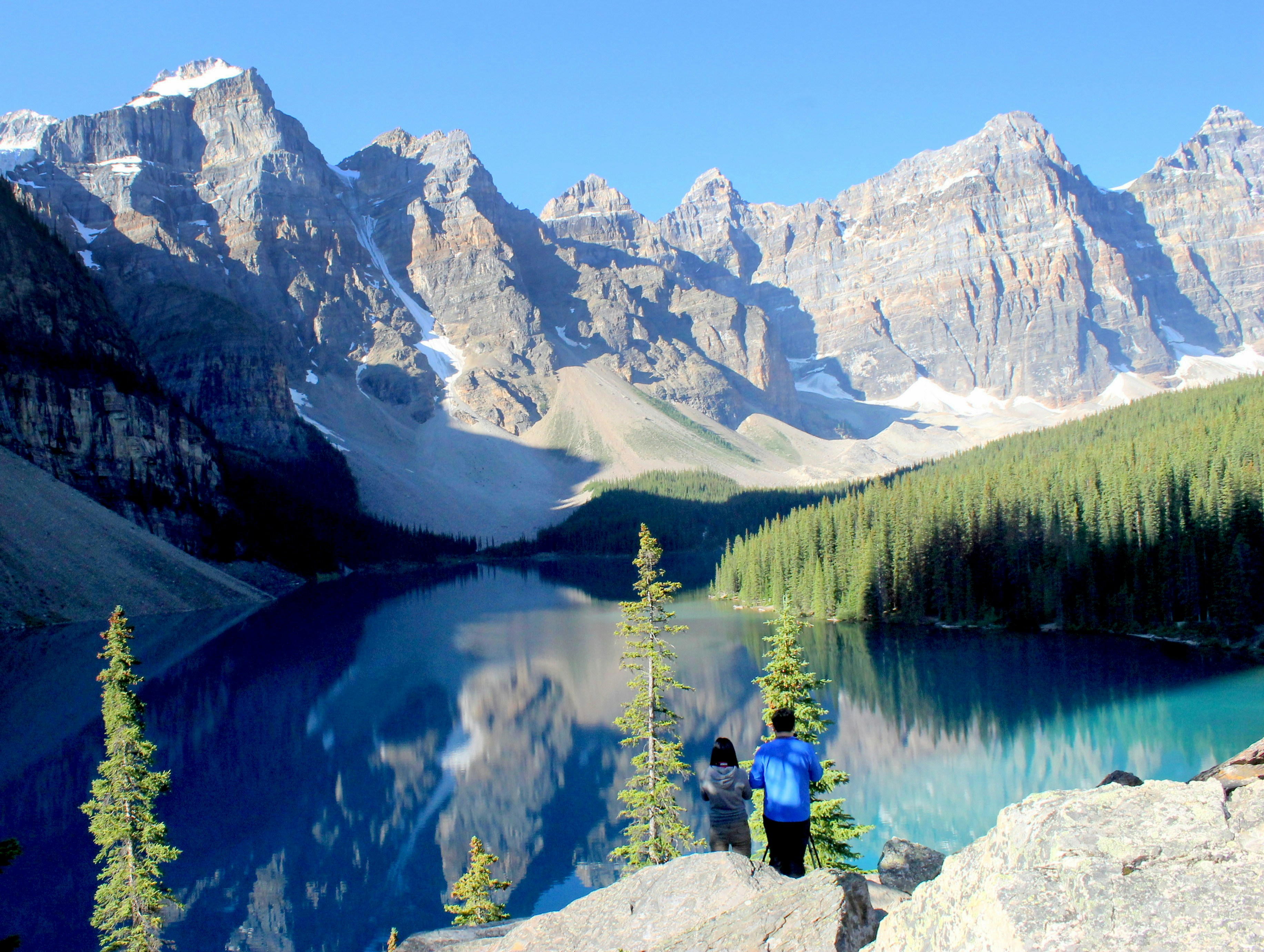 Emerald Mirror: Mountain Lake and Lonely Hiker
