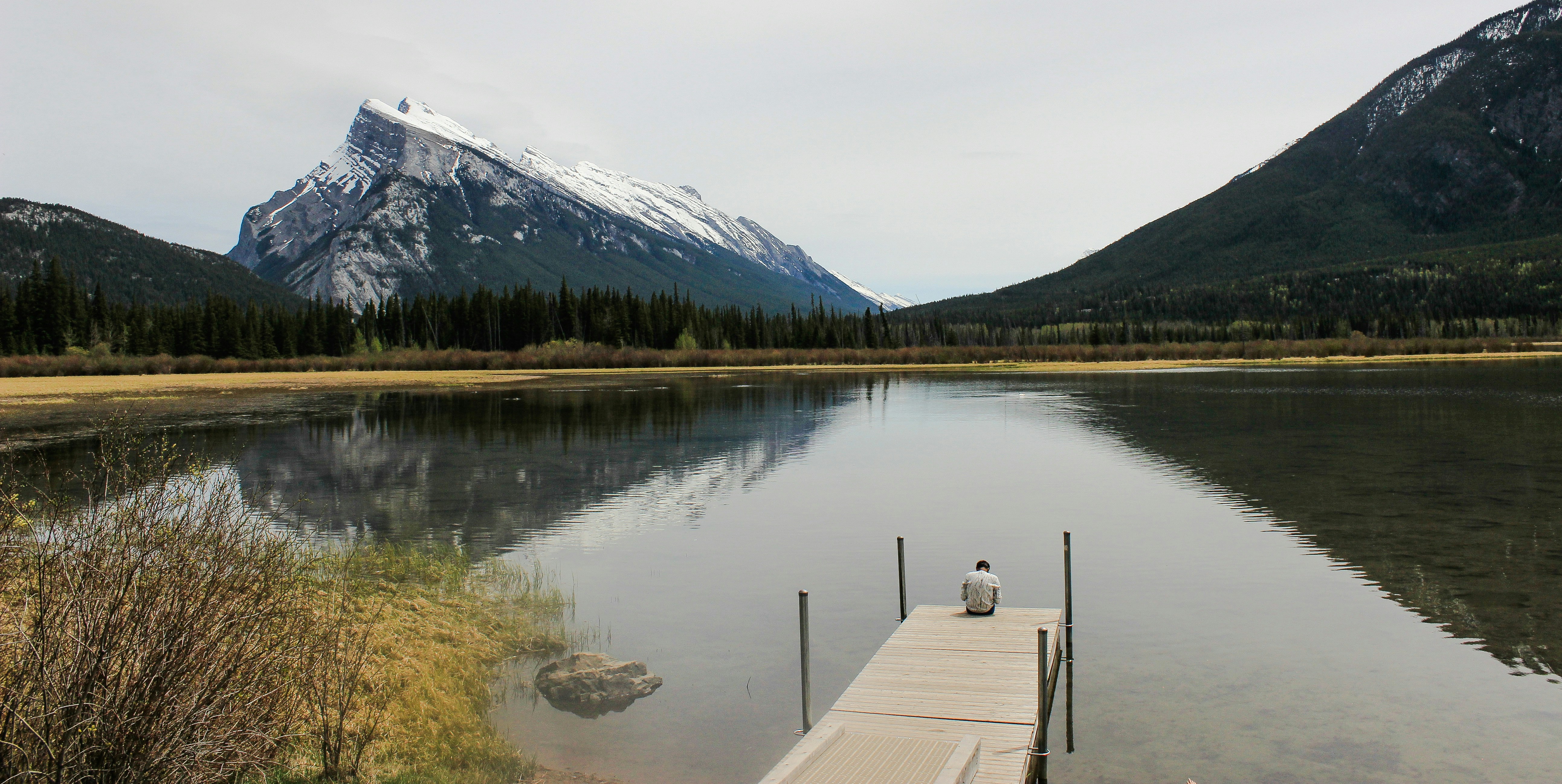A scenic landscape captured in Alberta, Canada, showing the natural beauty of the Canadian Rockies during summer. Shot in lBanff at Vermiliion lakes.