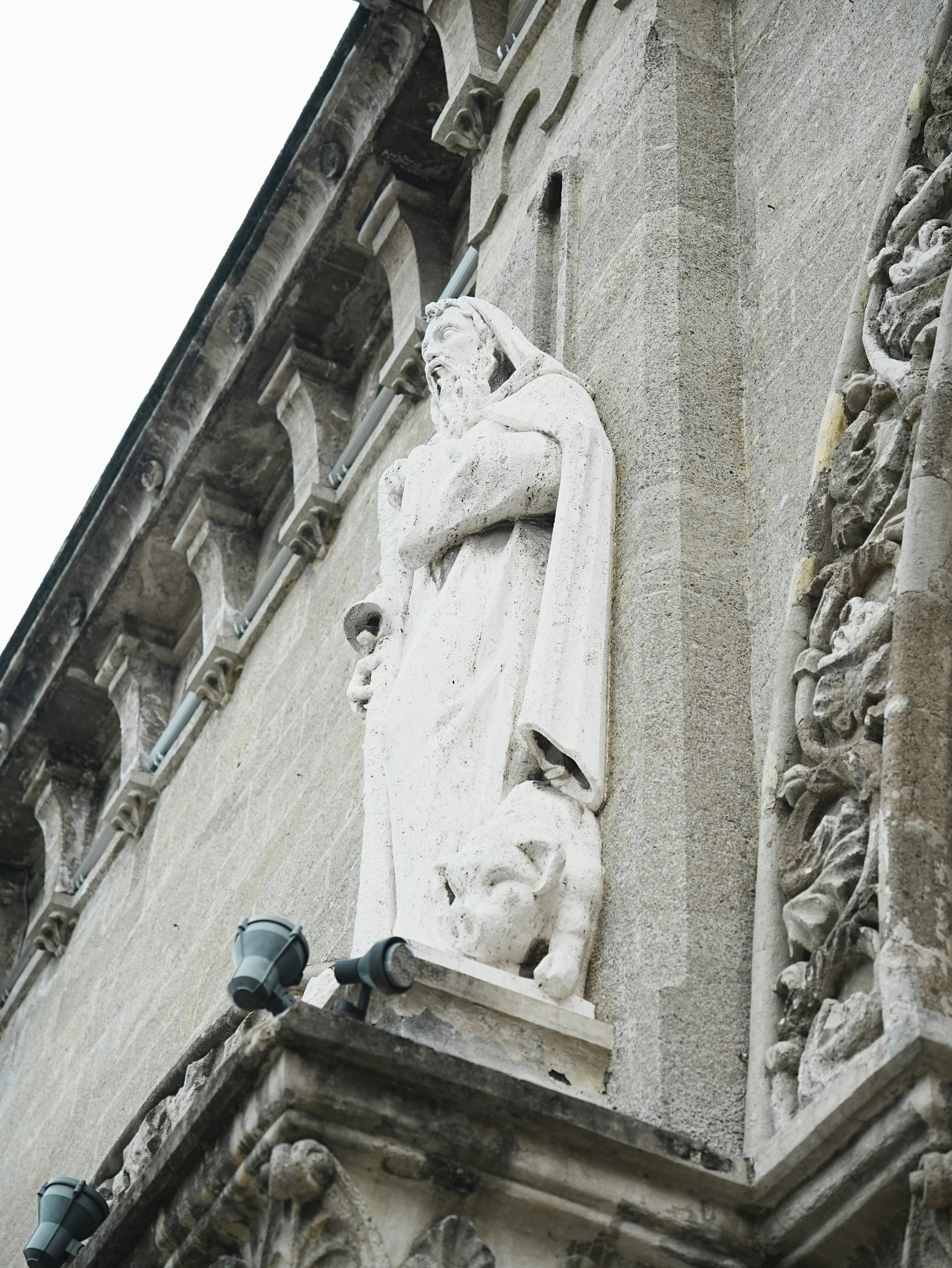 Stone Carved Guardian Above the Entrance