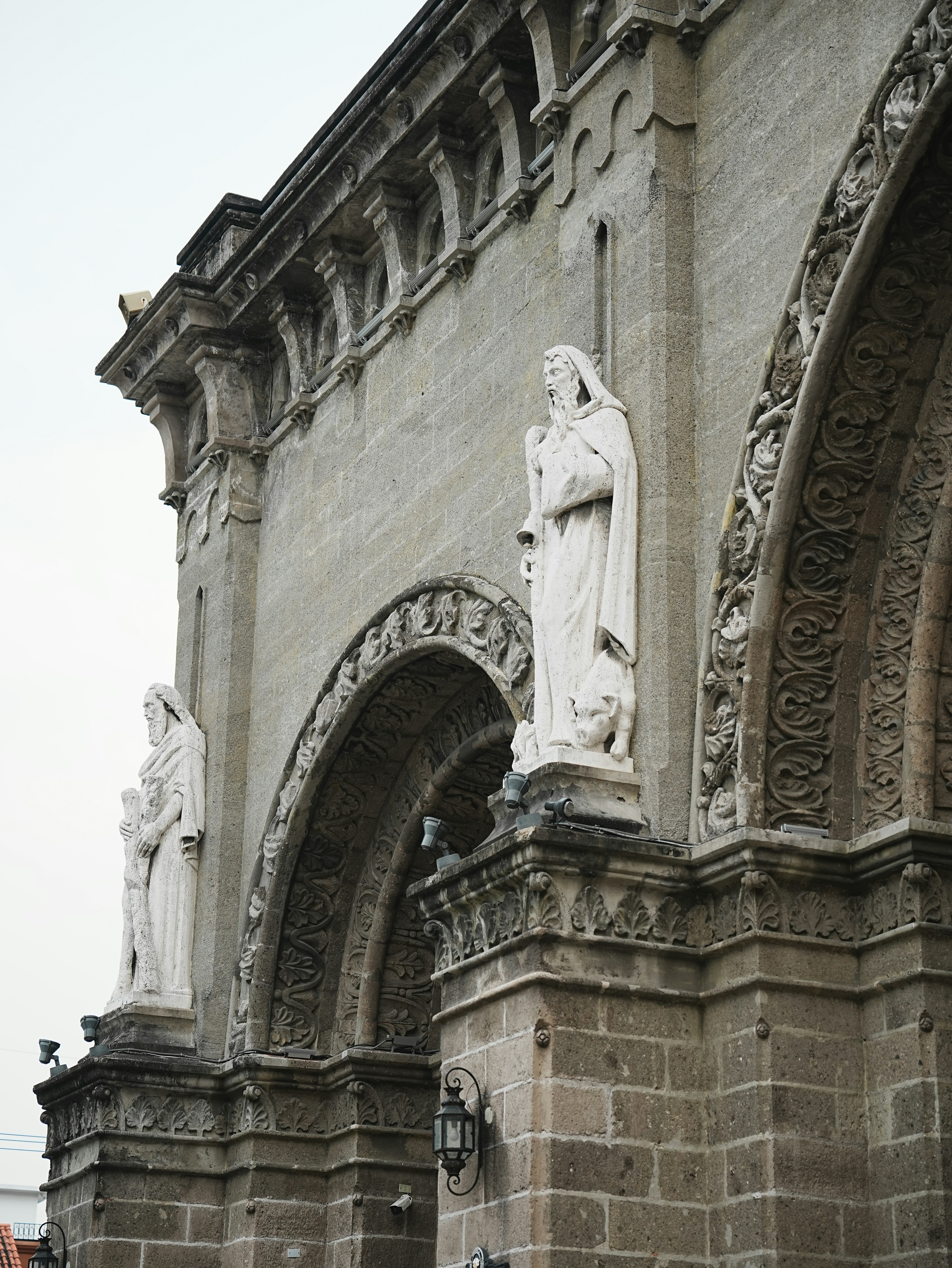Stone Saints Guard the Archway: A Close-Up of Historic Carvings