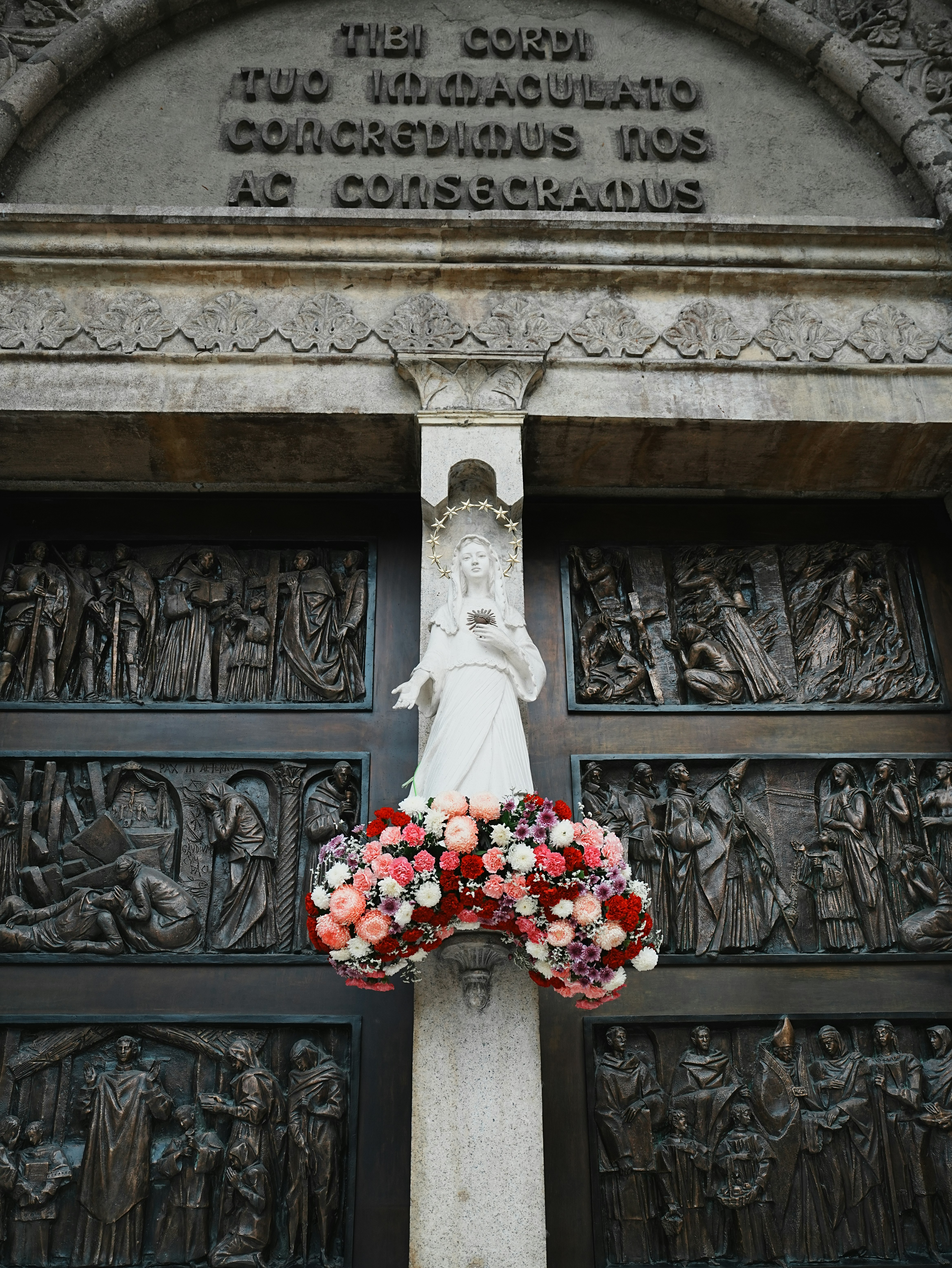 Statue of Mary with Floral Tribute at a Detailed Clerestory Arch