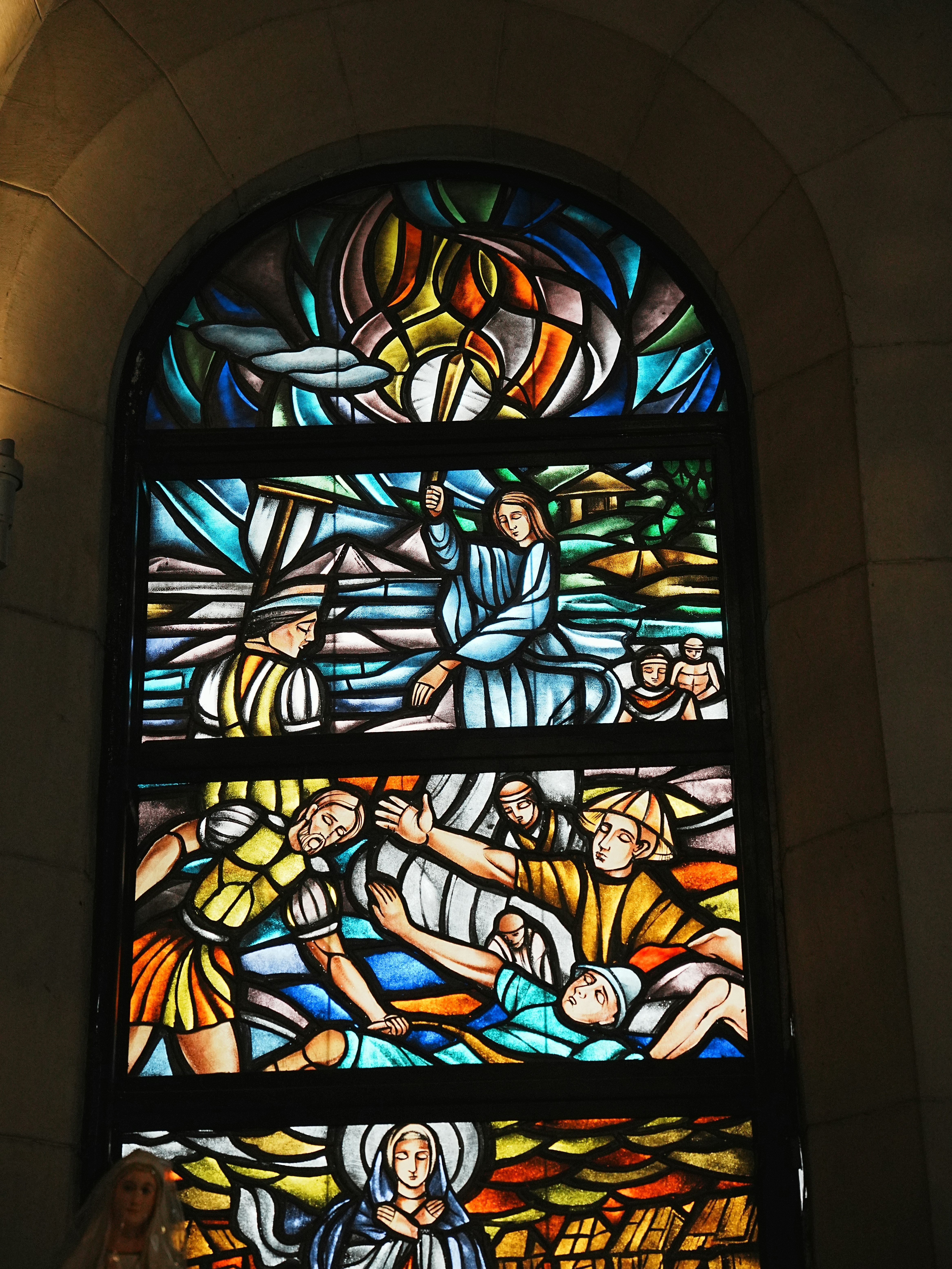 Stained Glass Narrative: A Lifesize Scene of Barricaded Hope and Healing