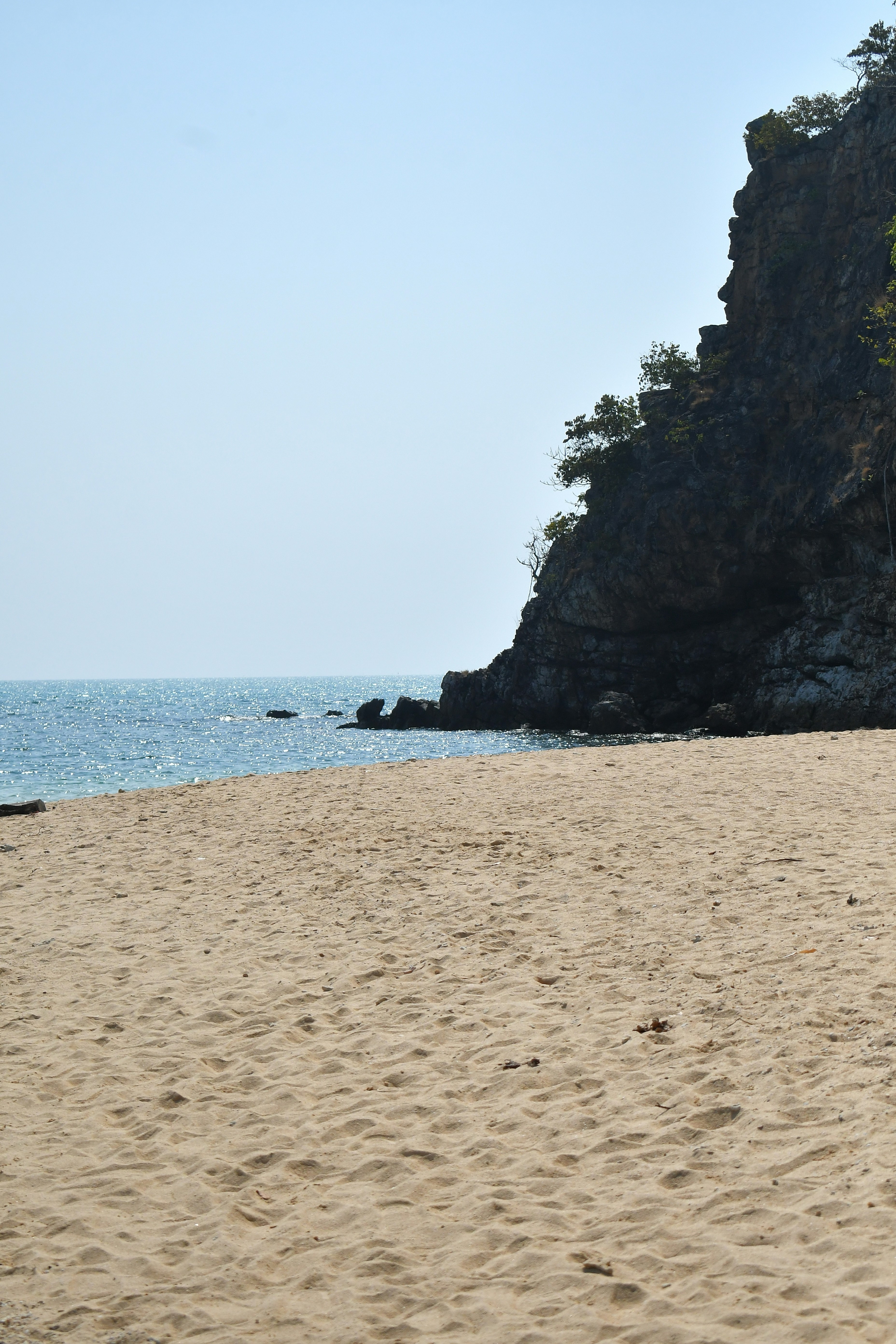 Cliffside Beach at Dusk: Quiet Sands Meet Ledge