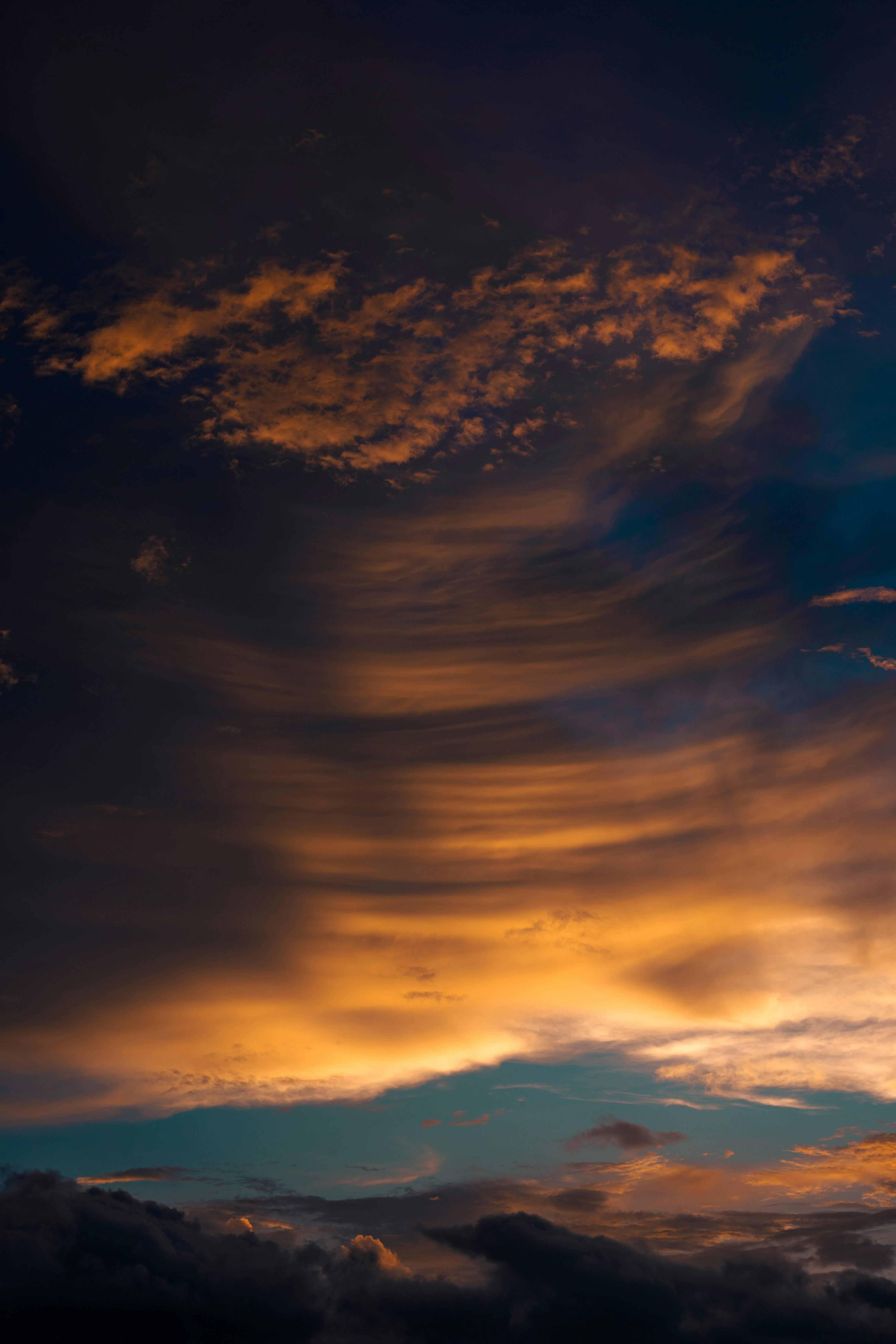 Caught Between the Ember Sky and Quiet Sea of Clouds